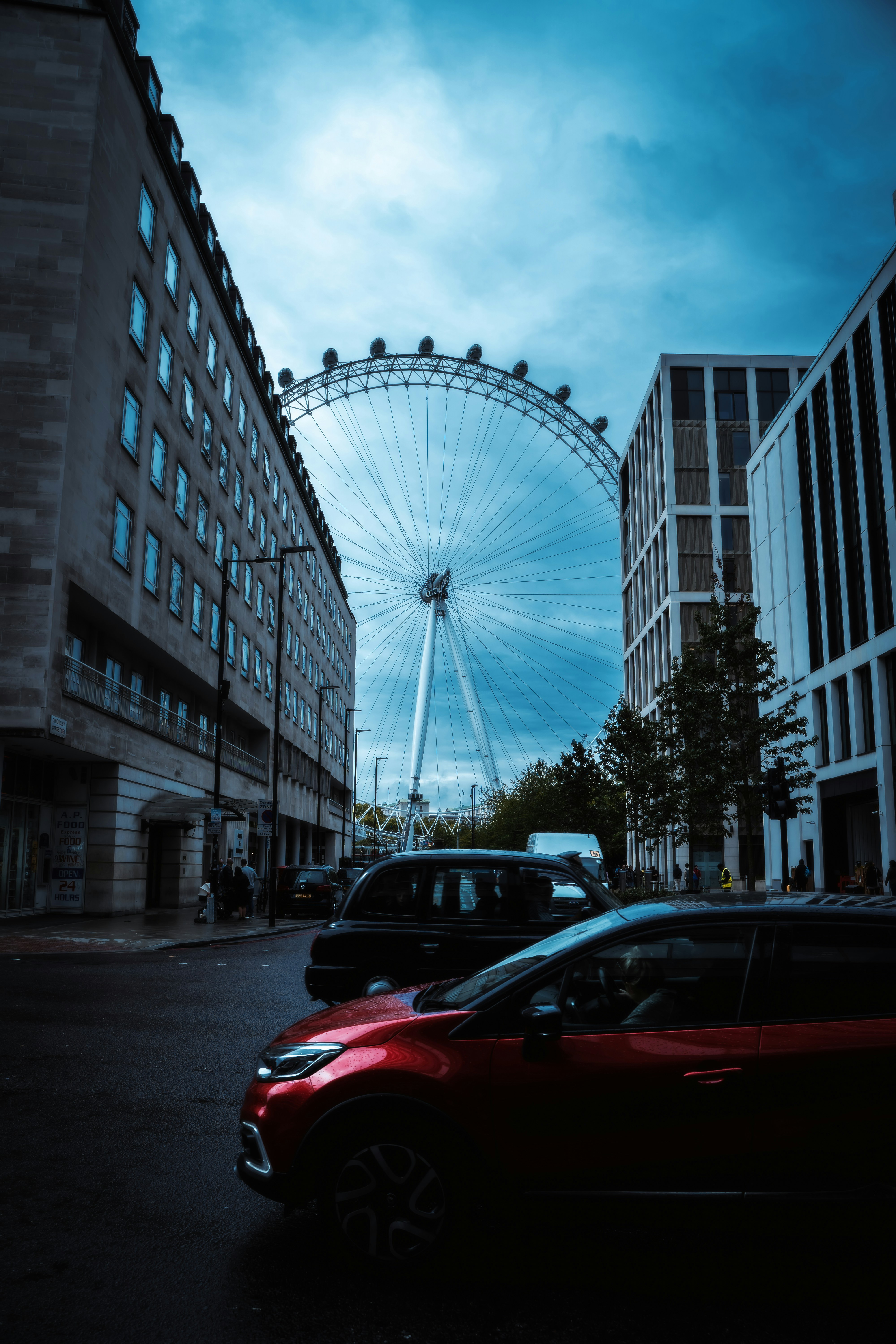 London Eye Framed by Evening Street