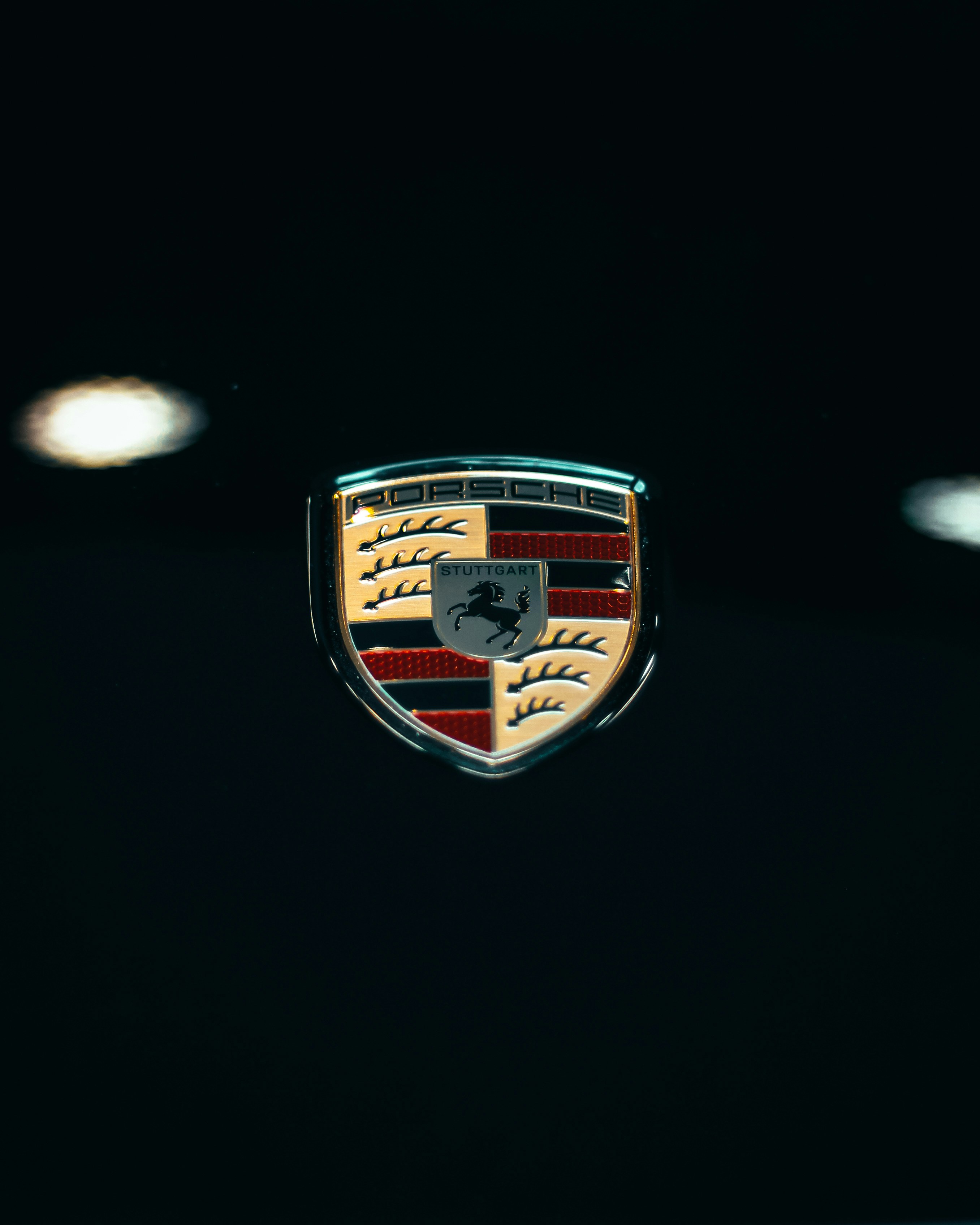 Midnight Crest: A Porsche Emblem in Focus