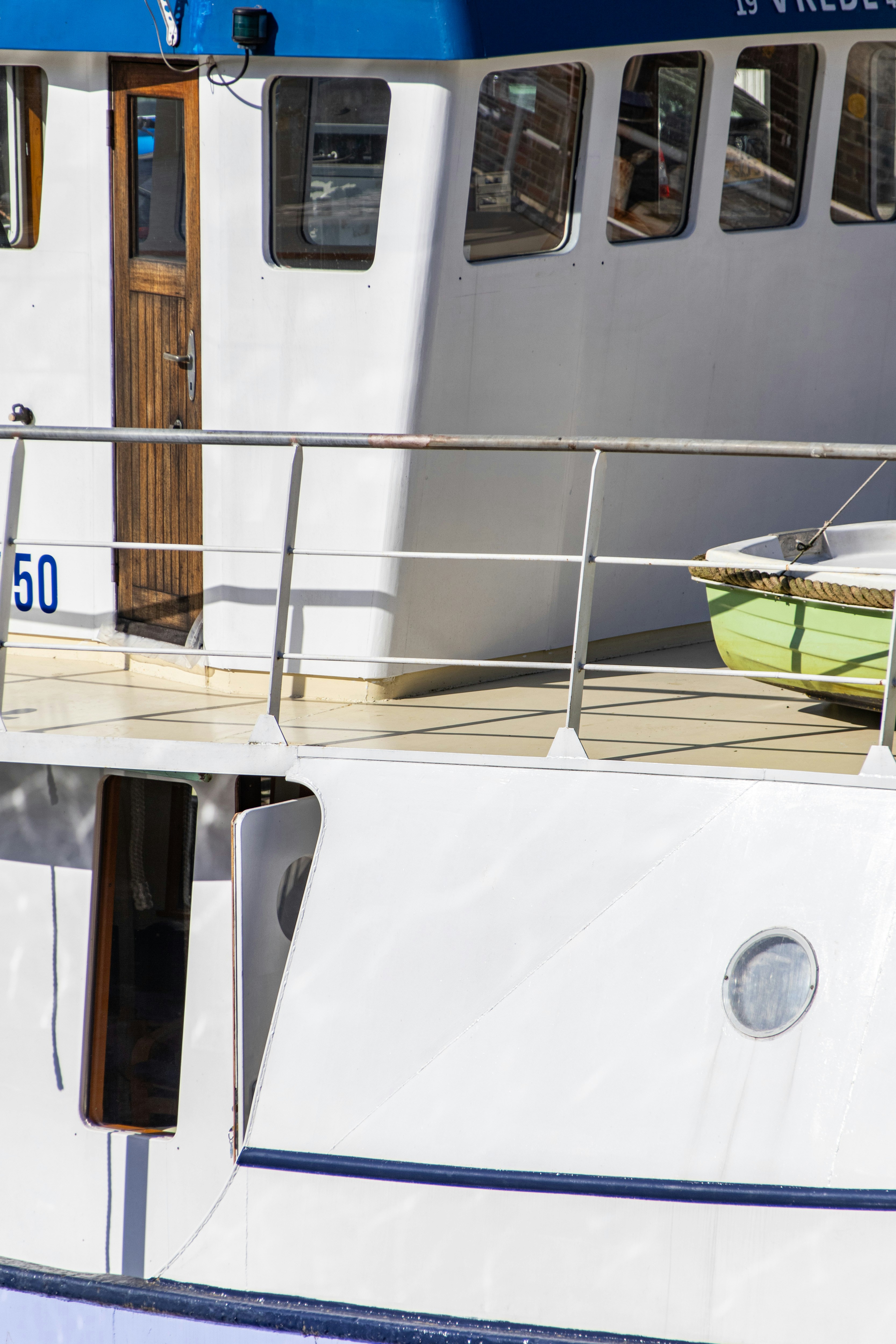 White Decked Vessel: Close-Up of Wheelhouse and Rail Dynamics