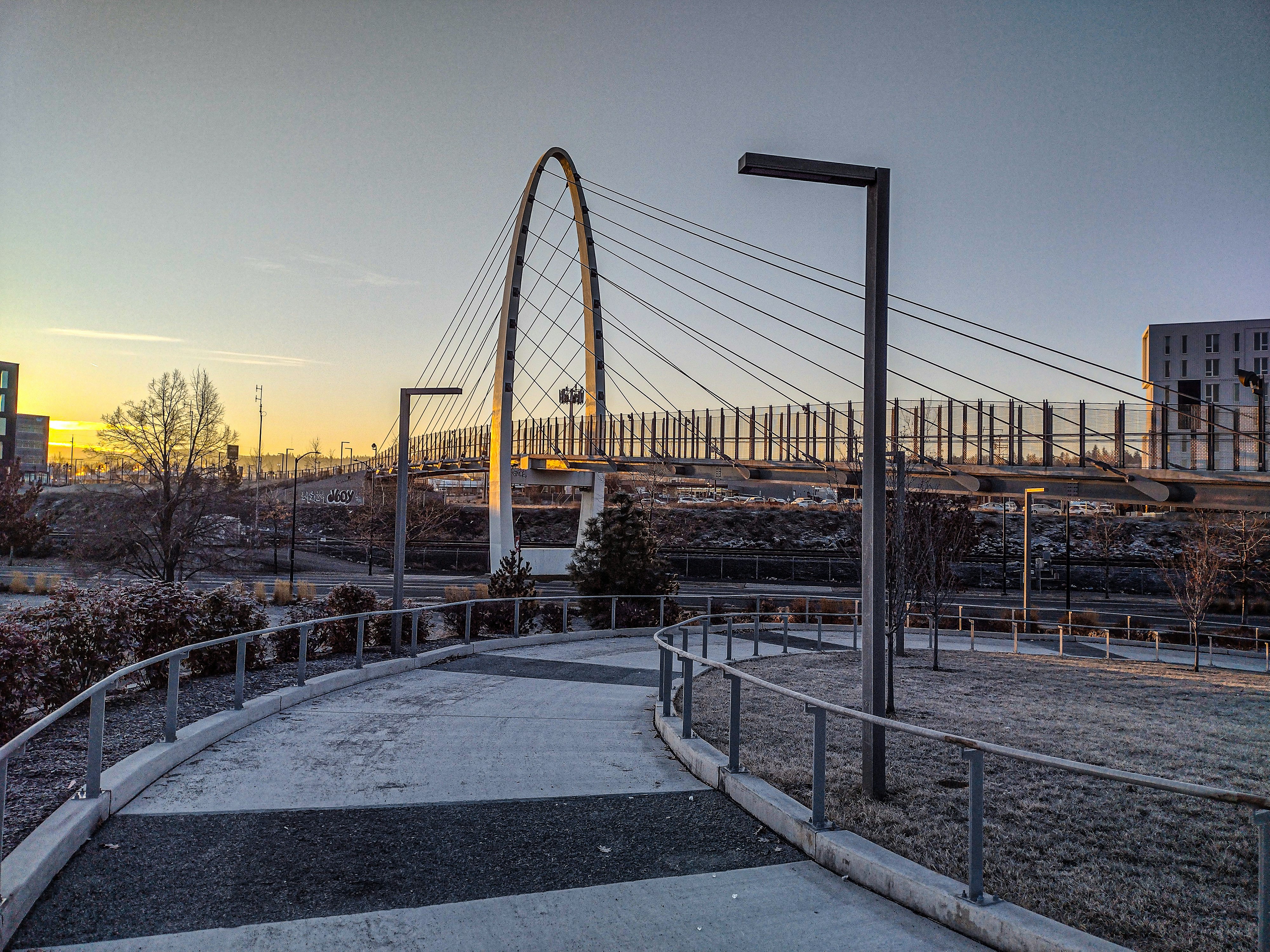 A bridge, a path, and a beautiful skyline.
