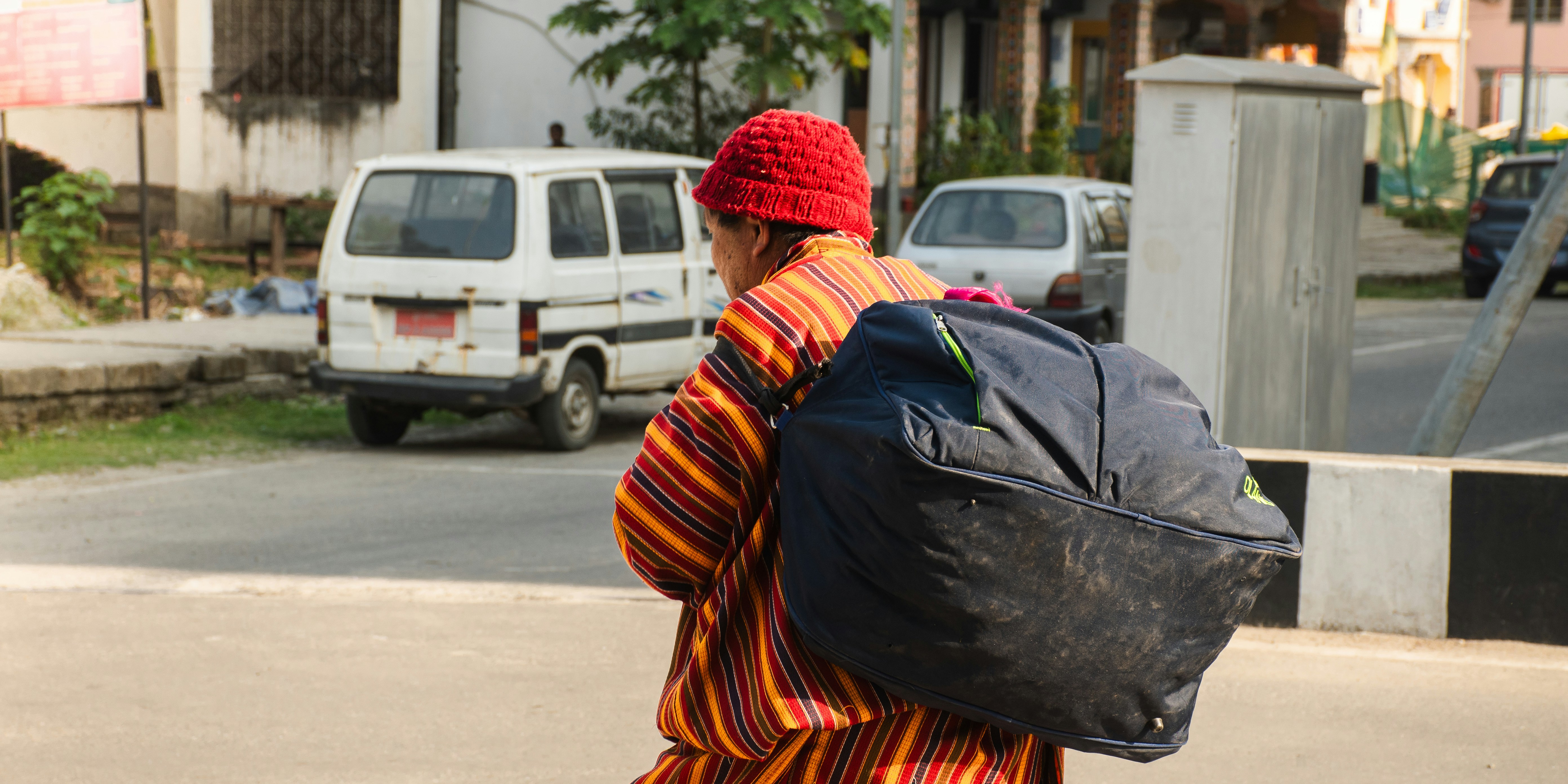 Stripe-Clad Traveler on a City Street