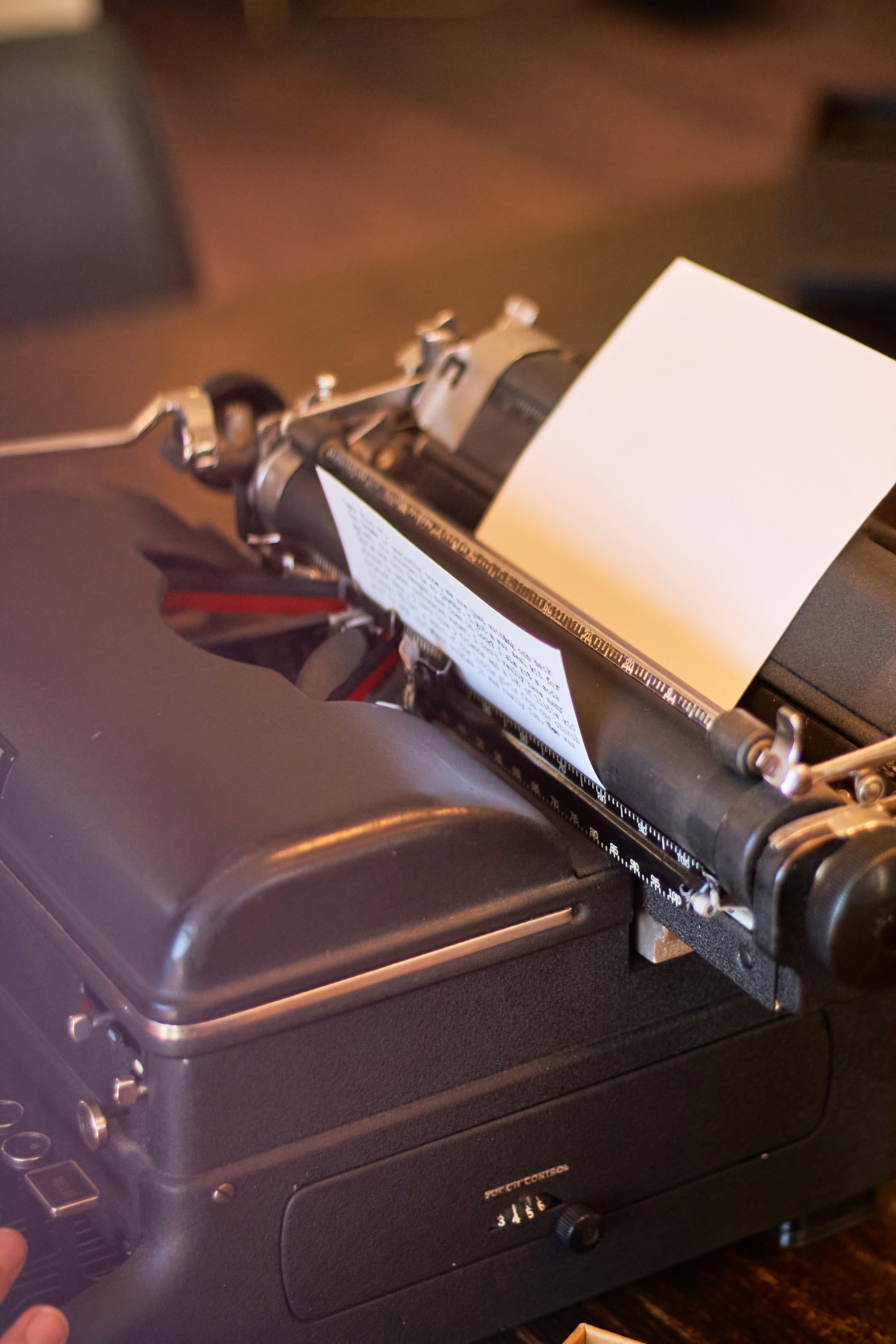 Blank Page in Warm Focus: A Vintage Typewriter Close-Up