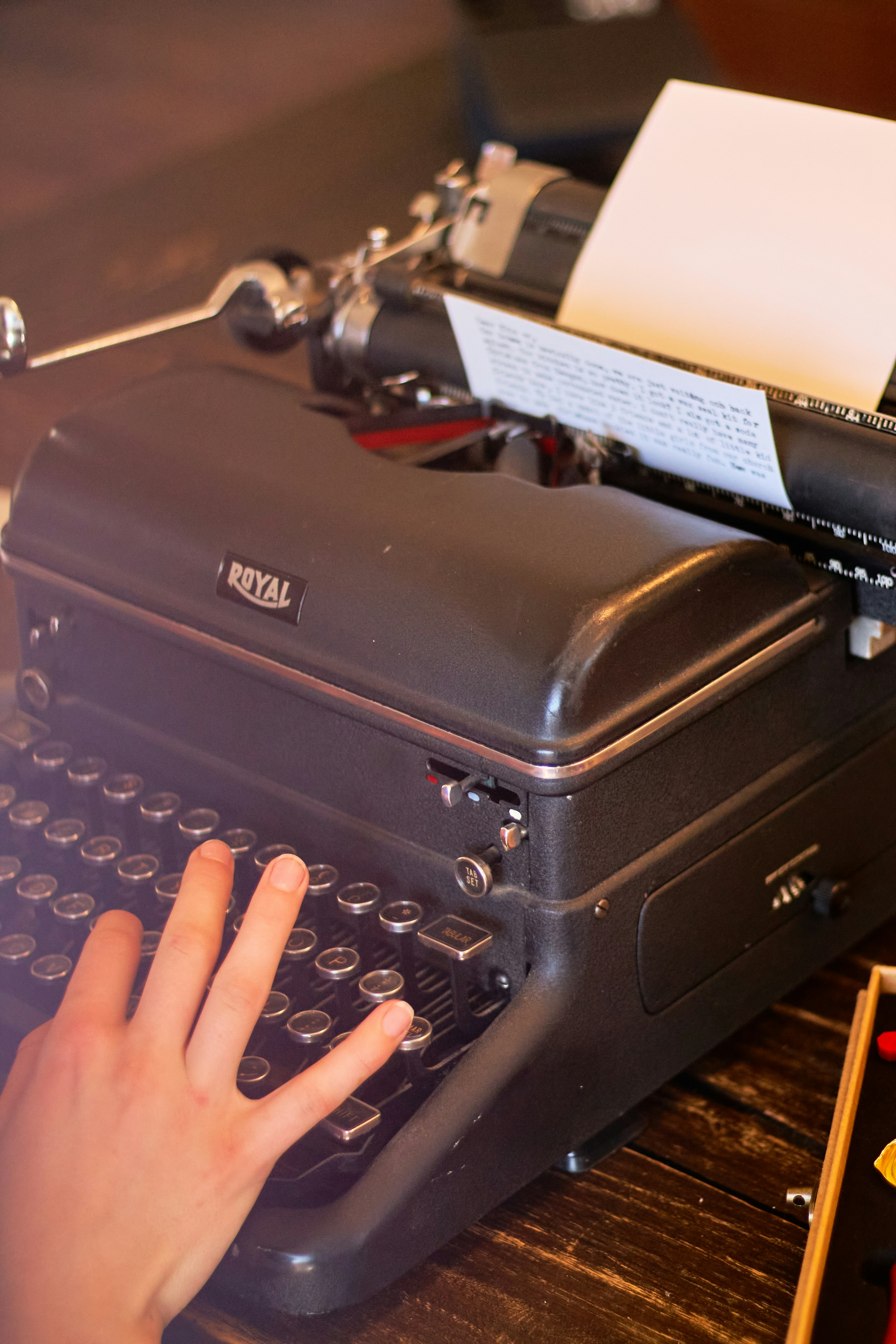 A hand types on a vintage royal typewriter. photo – Free Computer Image ...