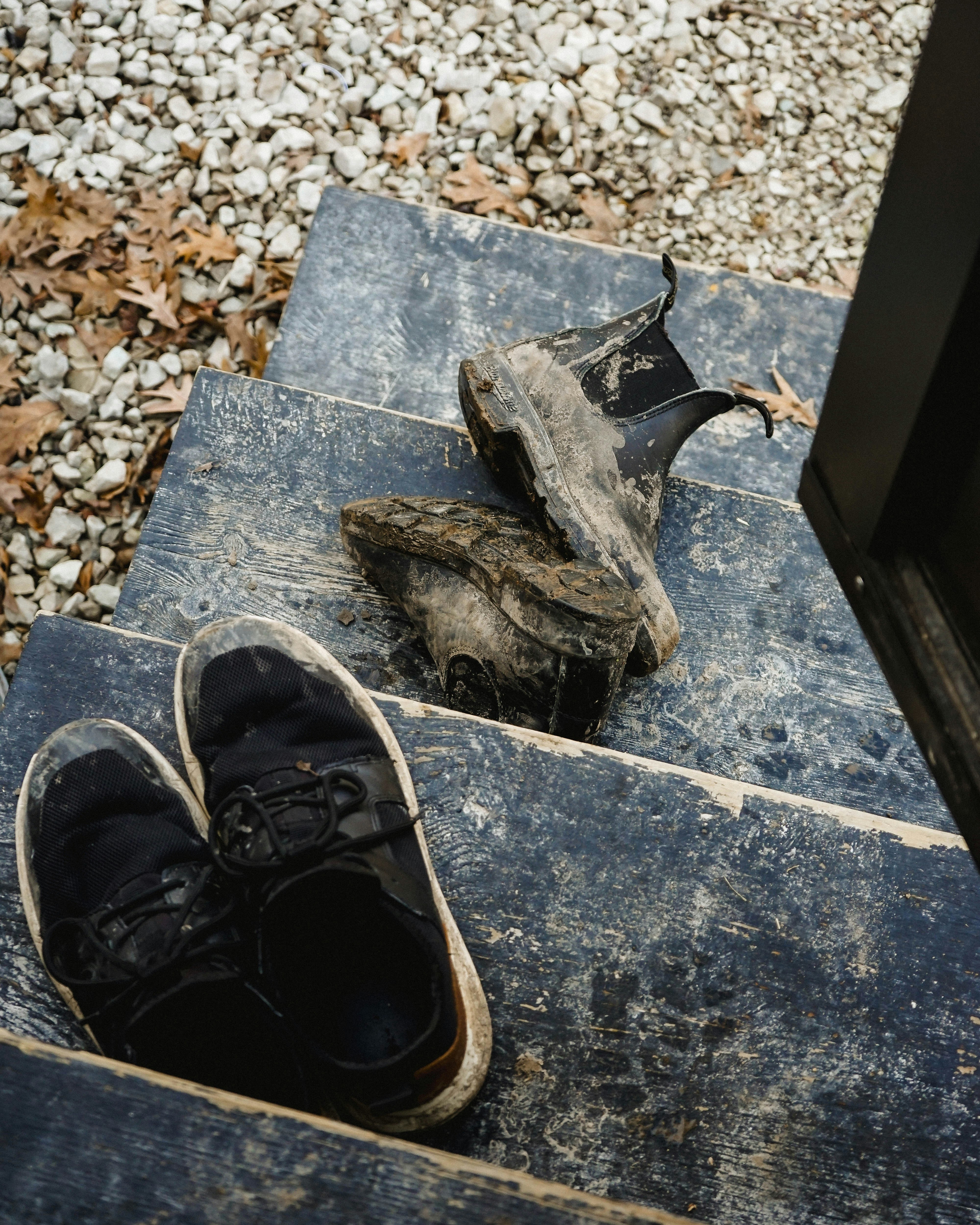 Mud-Streaked Steps: A Pause at the Threshold