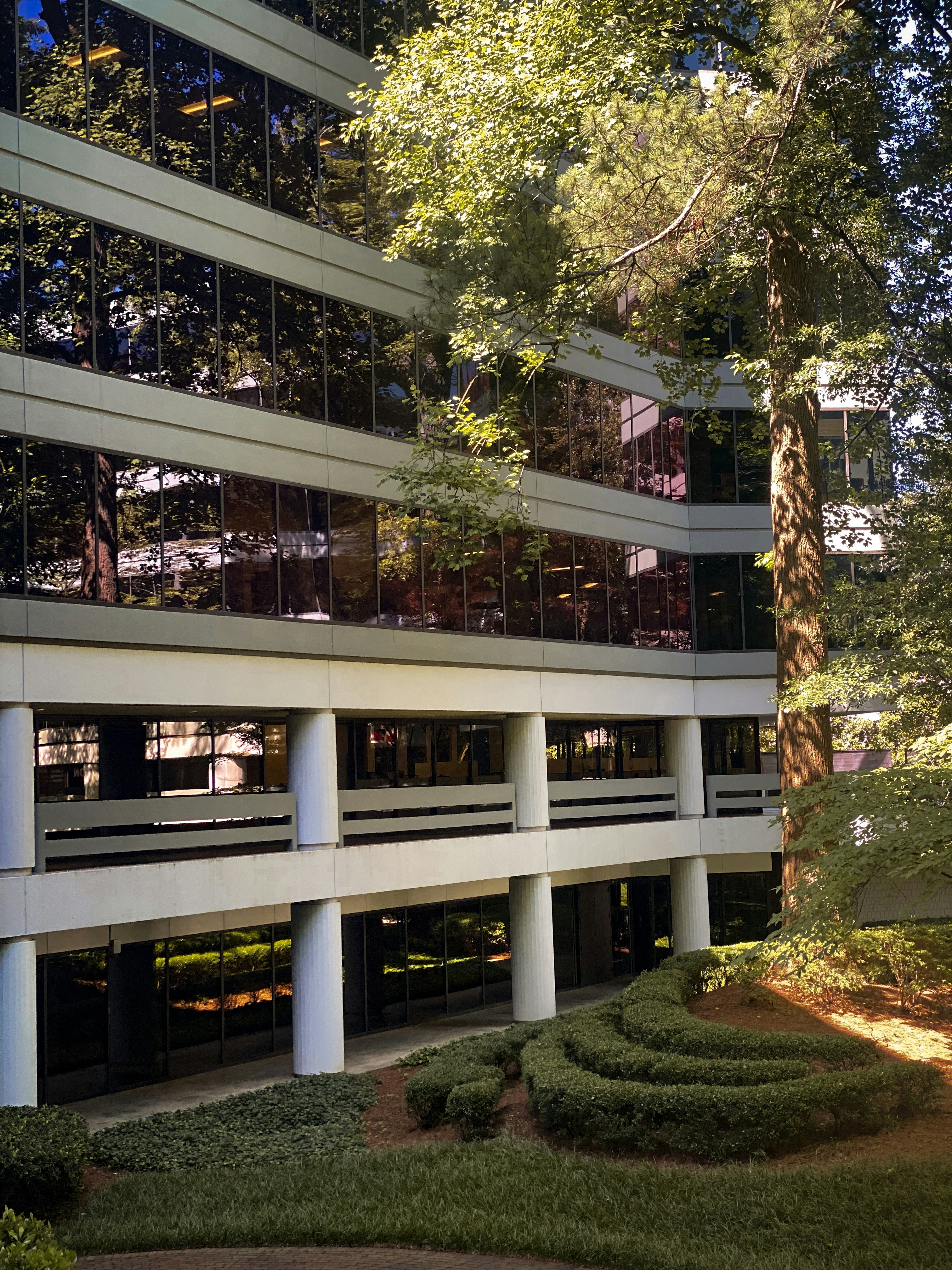 A modern office building blends with the natural landscape. photo ...