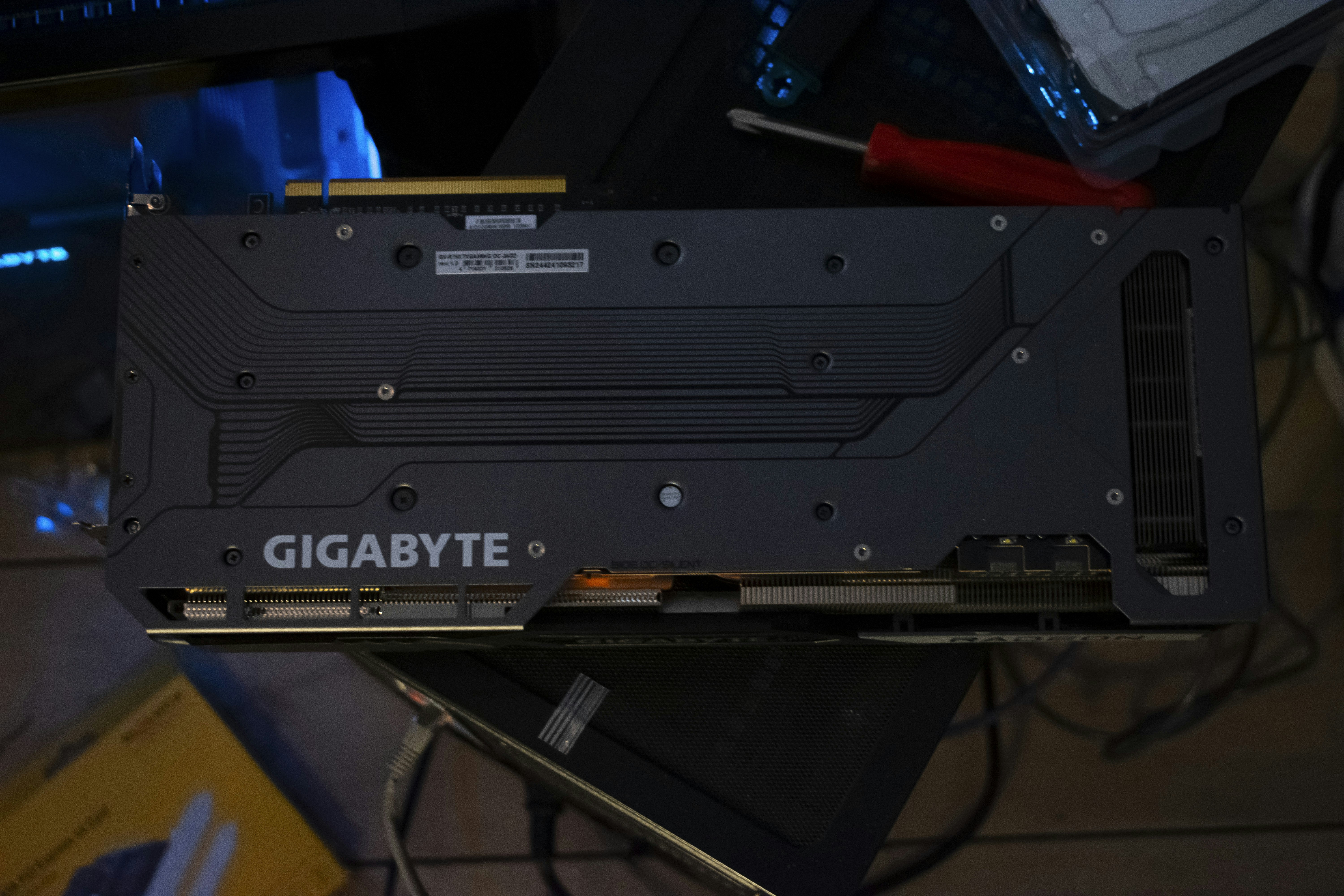 A gigabyte graphics card's backplate is visible. photo – Free ...