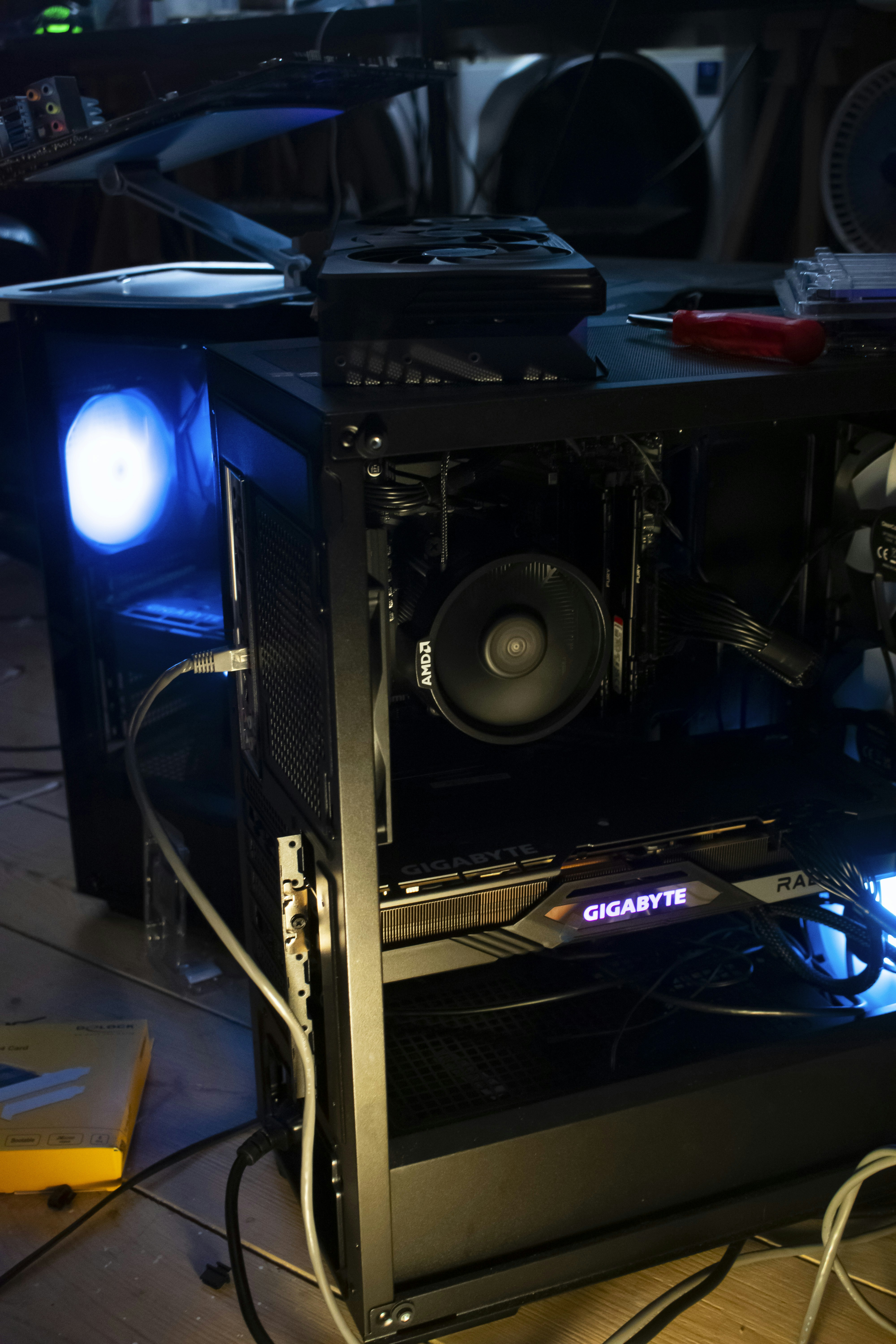 Underside Glow: A Compact PC Rig Under Blue Accent Lighting