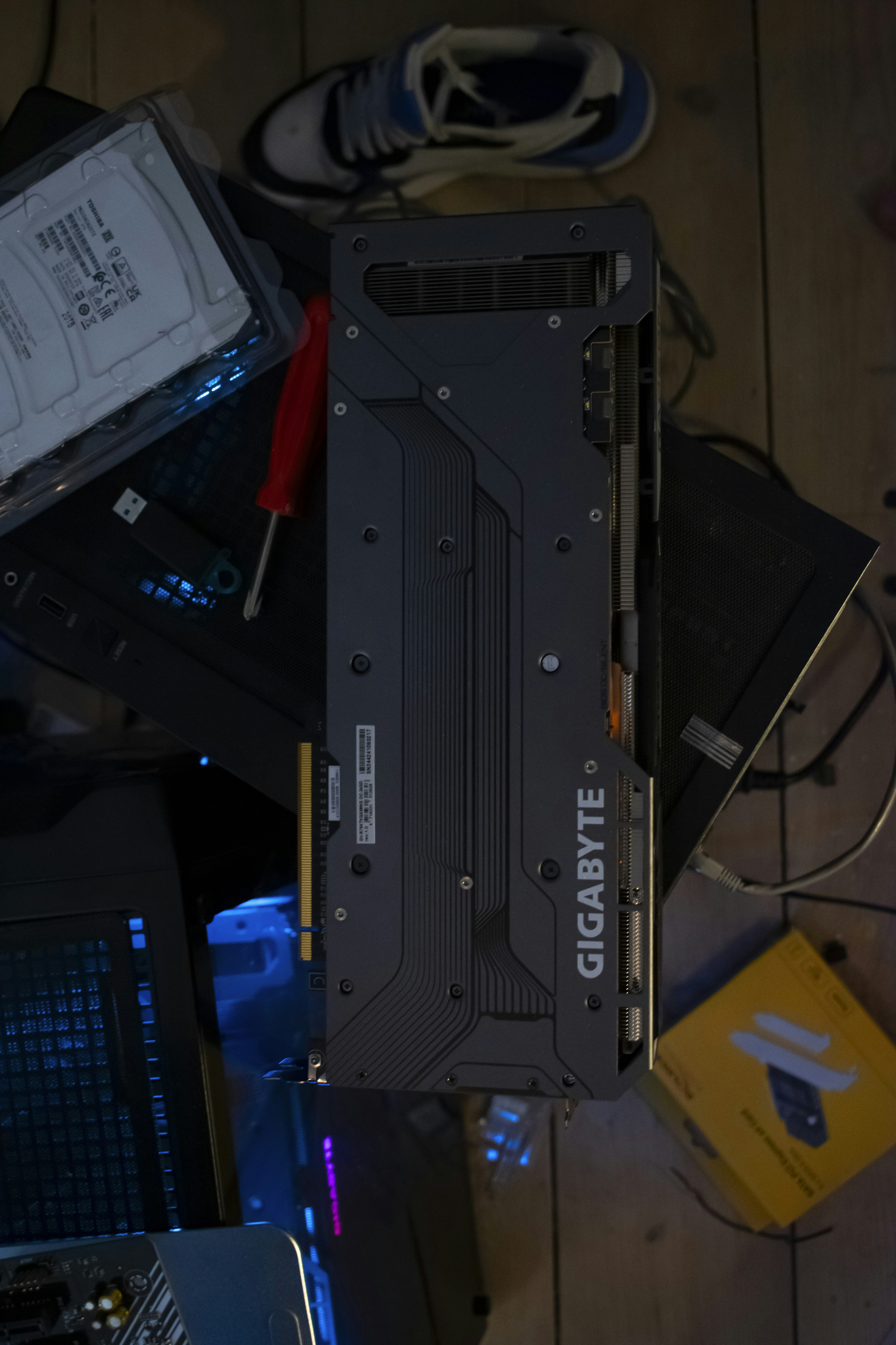 Gigabyte graphics card on a messy surface. photo – Free Technology ...