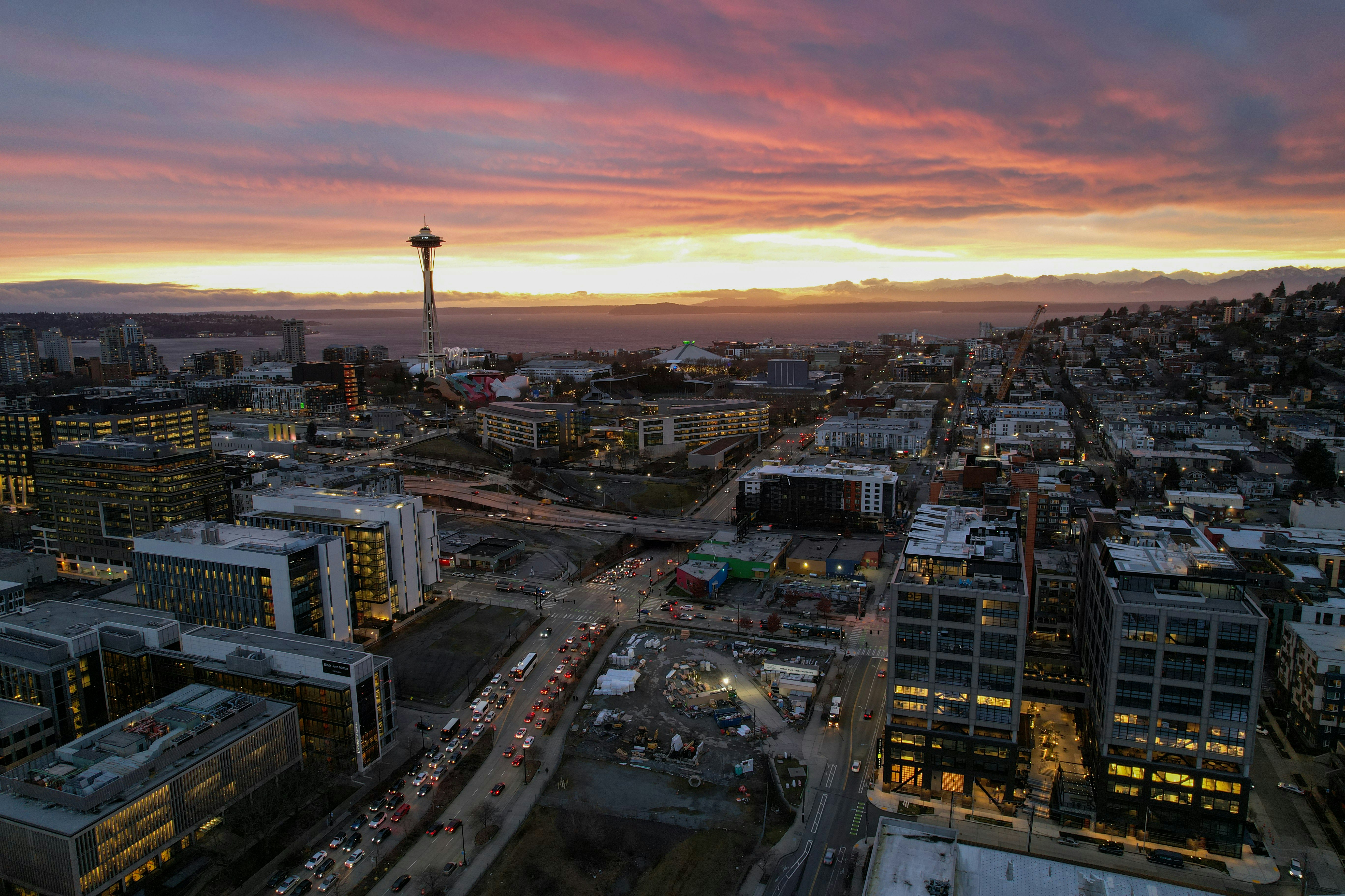 Seattle skyline at sunset with vibrant clouds and the Space Needle.