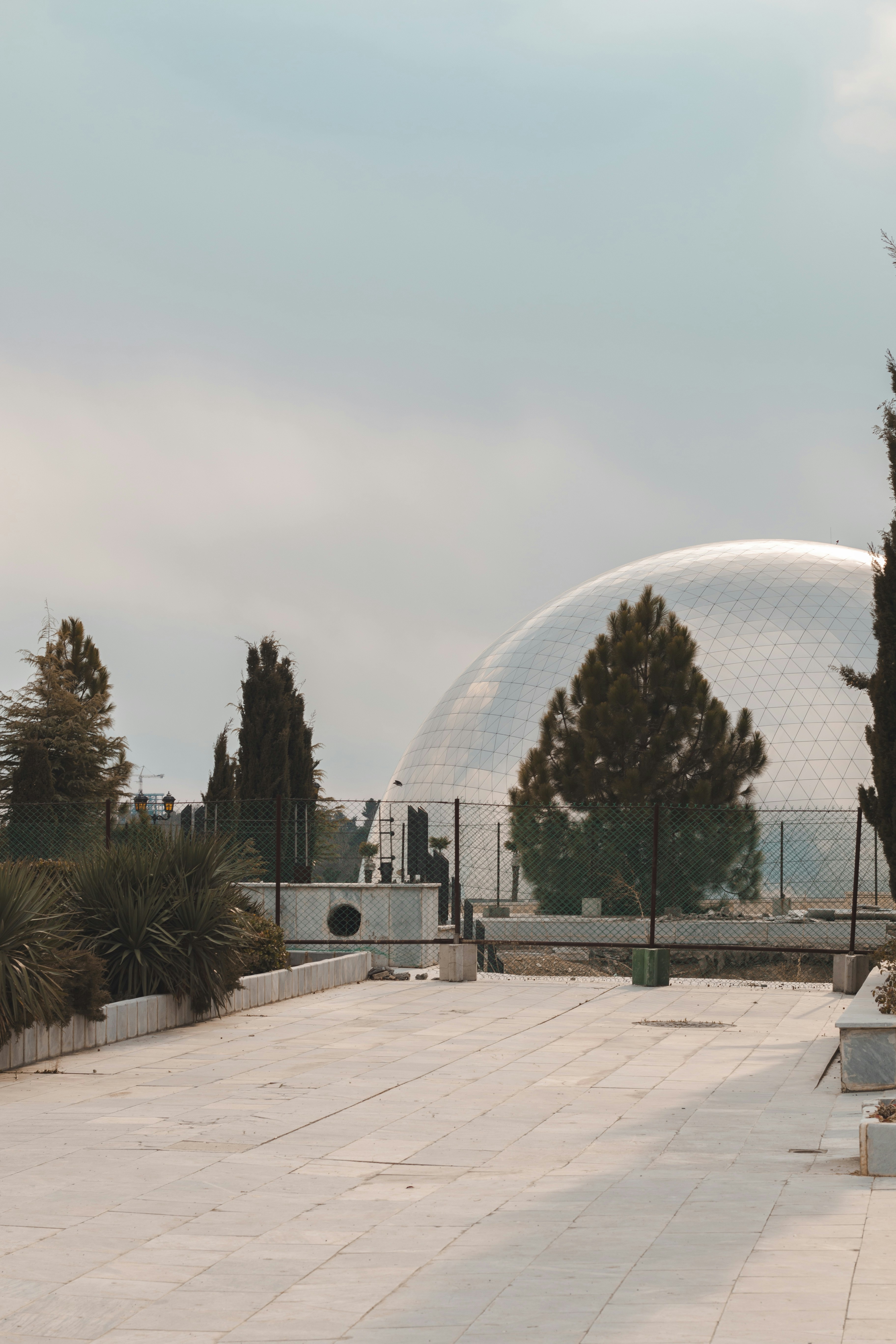 Geodesic Dome Over a Quiet Rooftop Terrace at Dusk