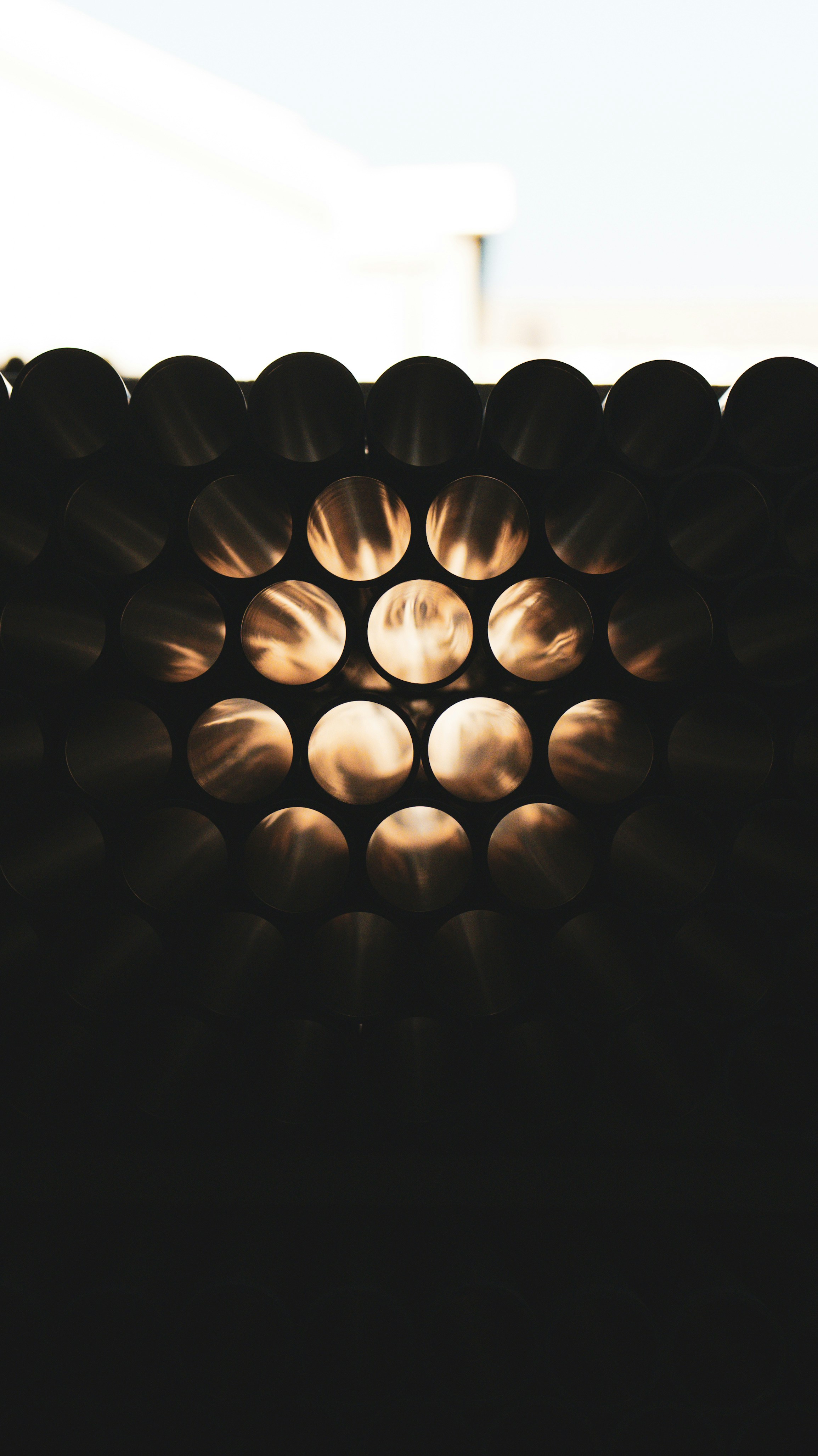 Centered Ember: A Close-Up Puzzle of Copper Tubes