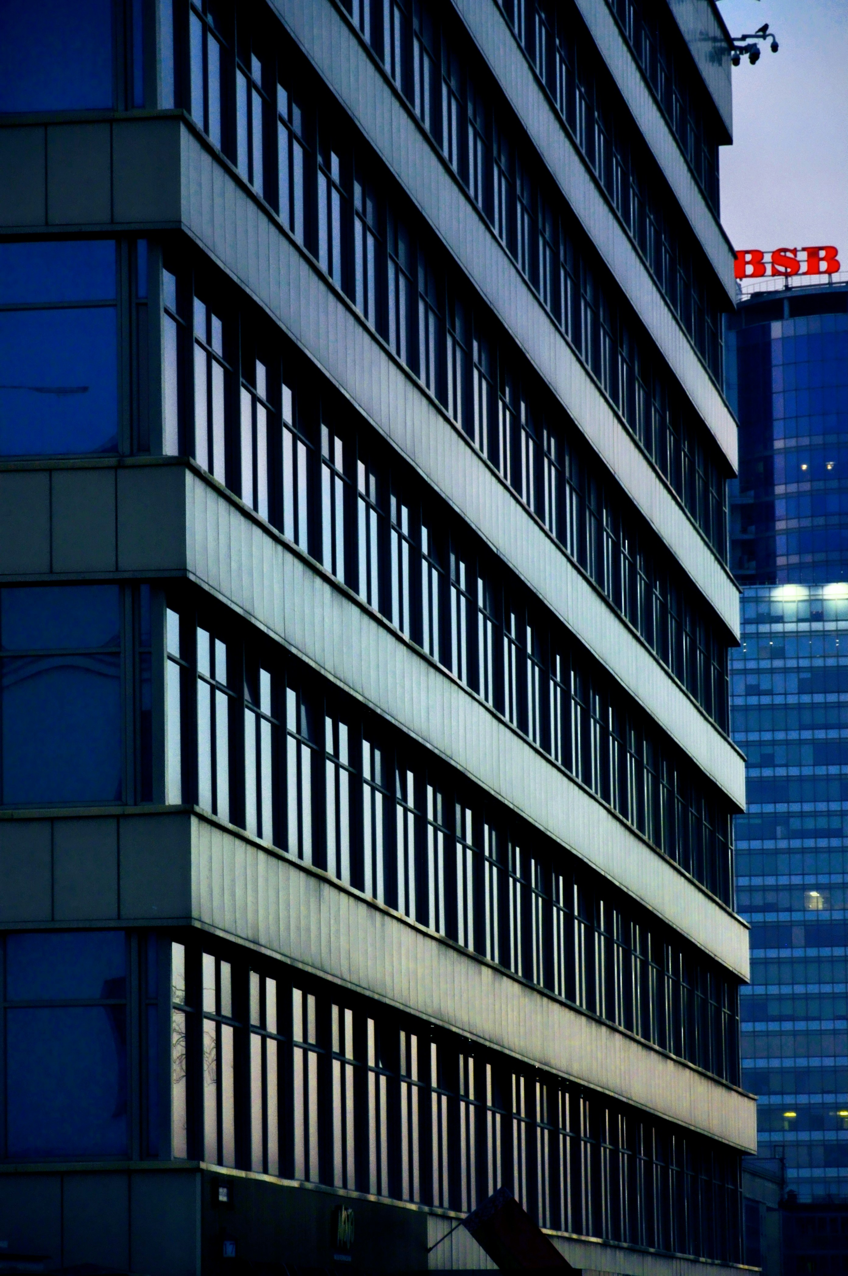 Tilted Facade: Echoes of a Blue Glass Grid