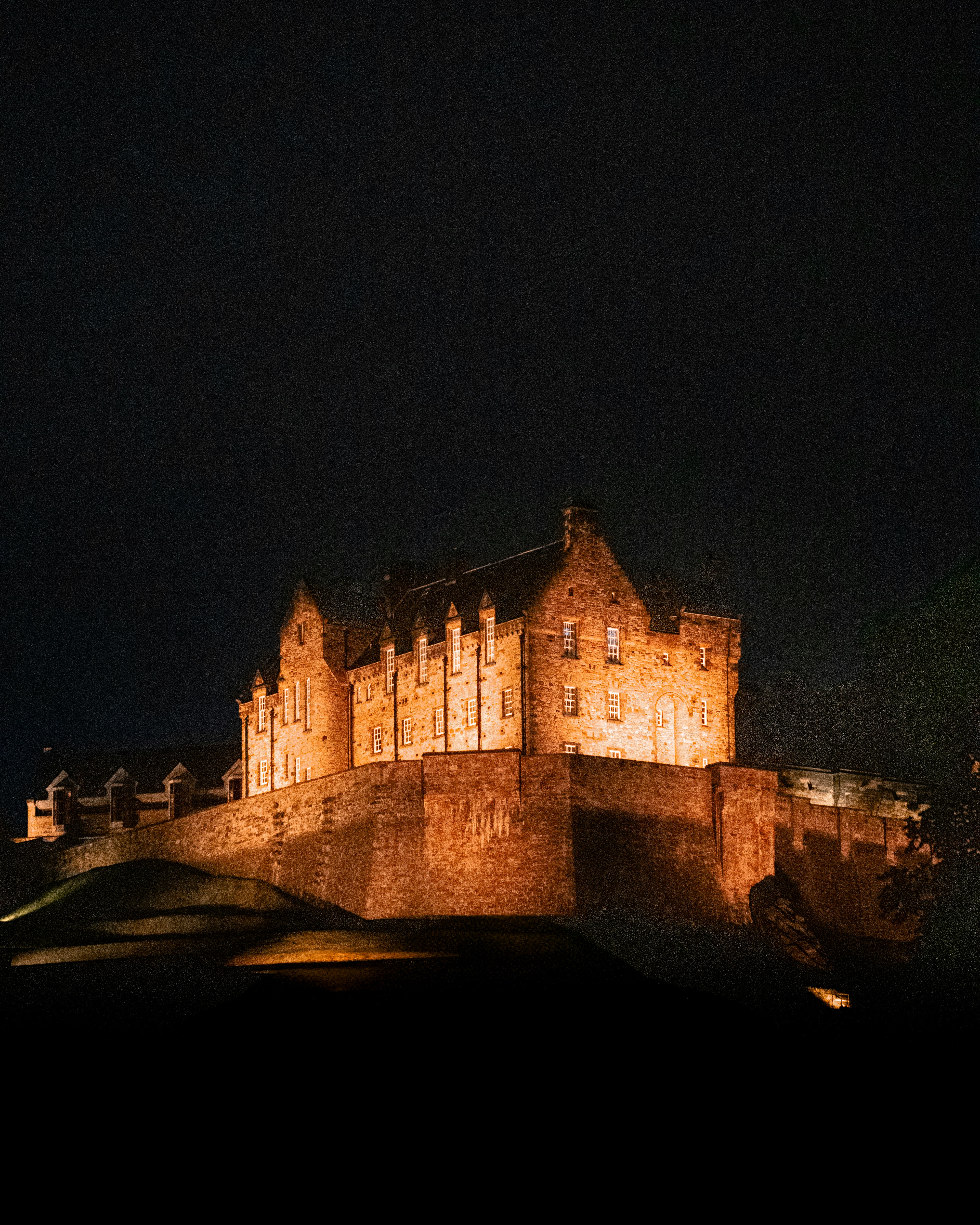 A lit-up castle stands proudly at night. photo – Free Building Image on ...