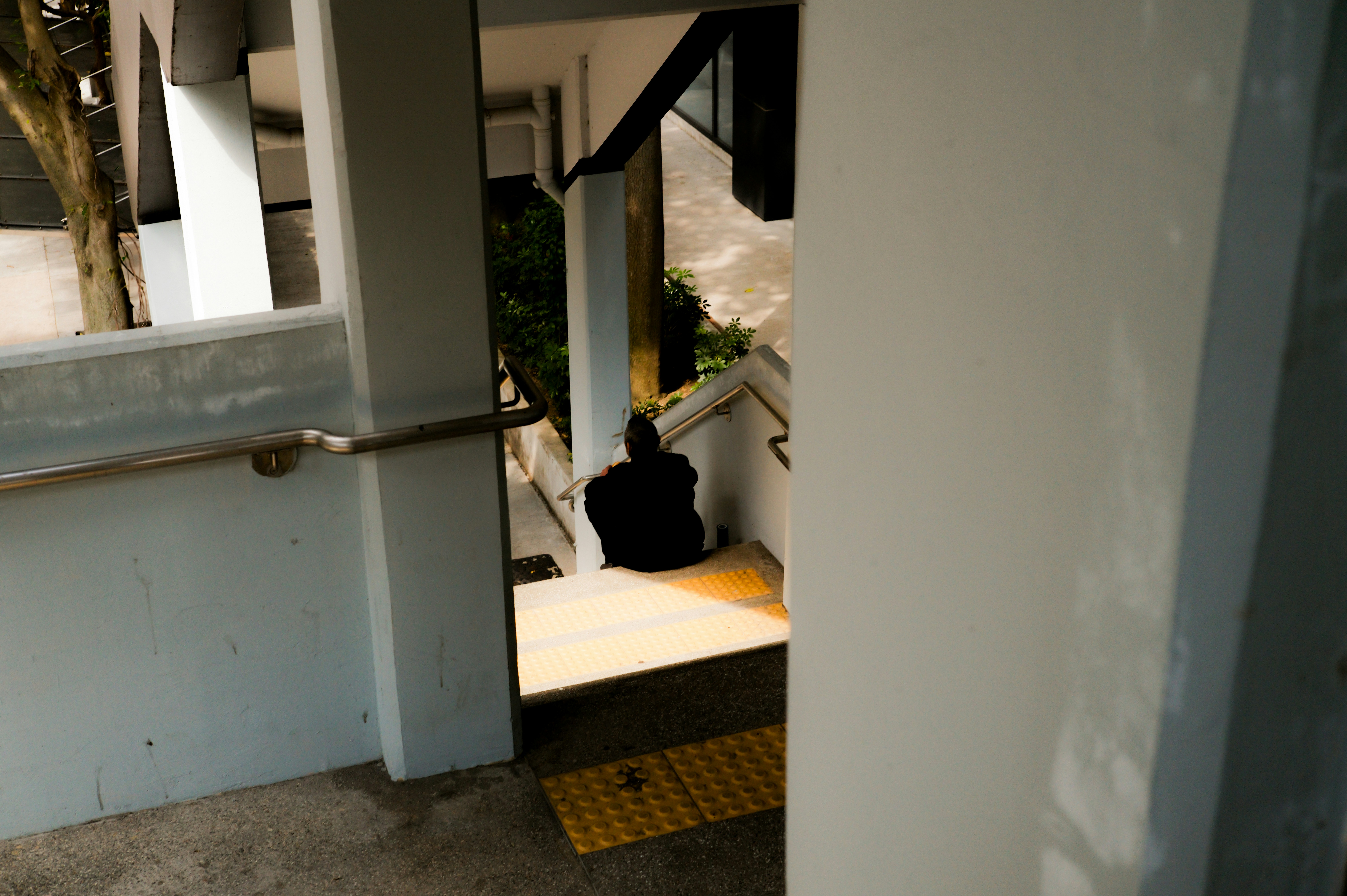 Solitary Pause on the Stairway