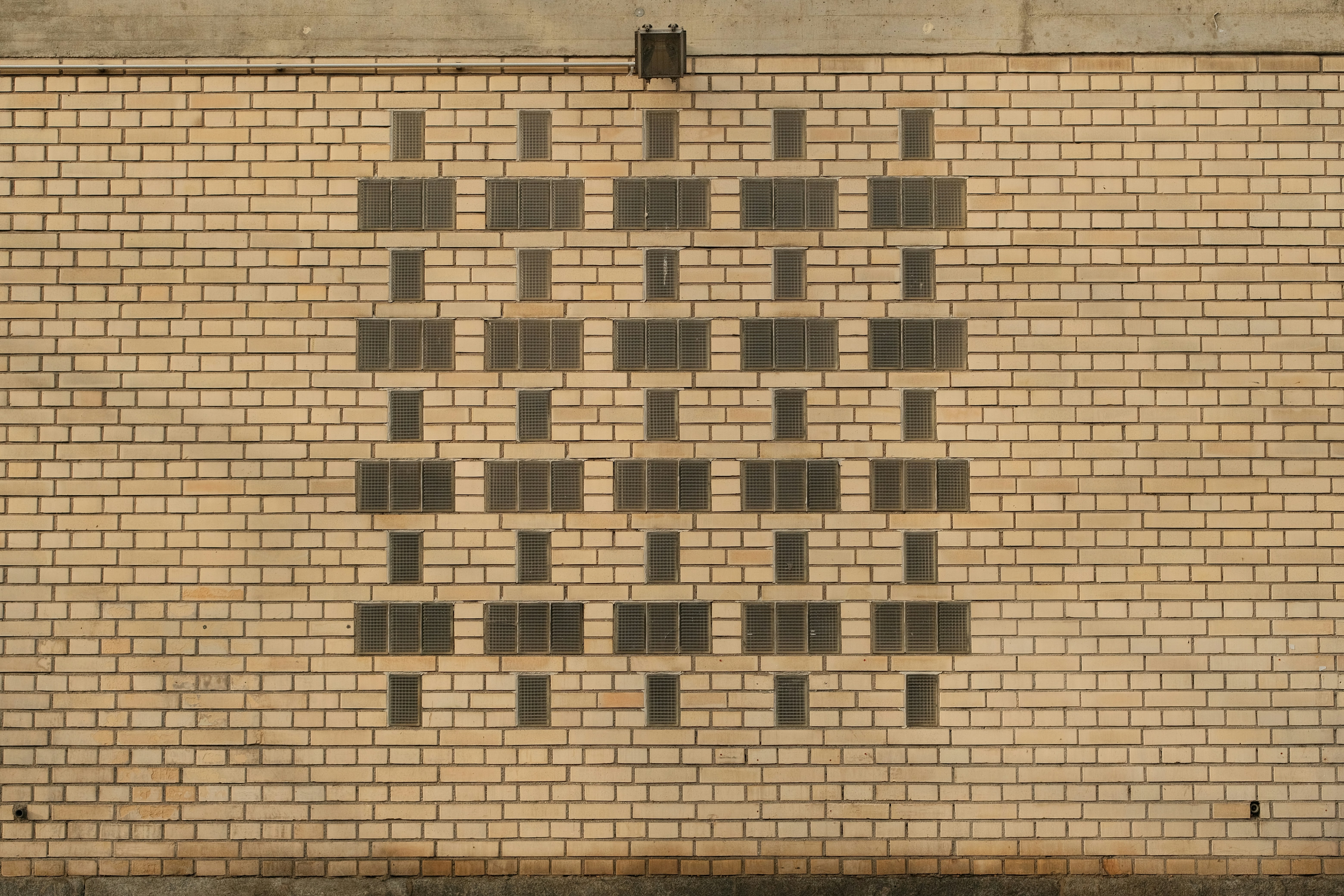 Bricked Grid: Sunlit Insets Create Quiet Rhythm