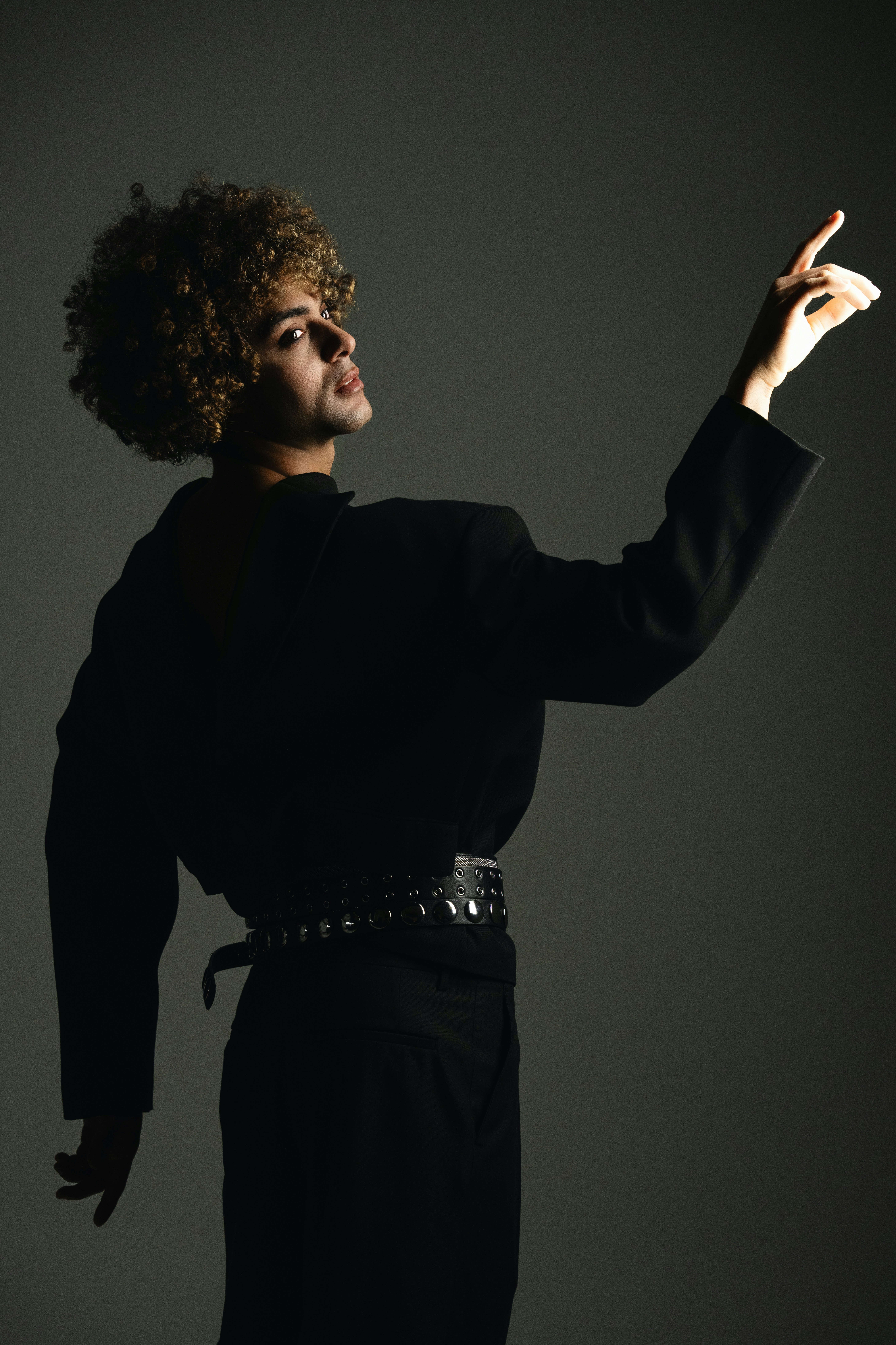 A person poses dramatically, reaching upwards. photo – Free Portrait ...