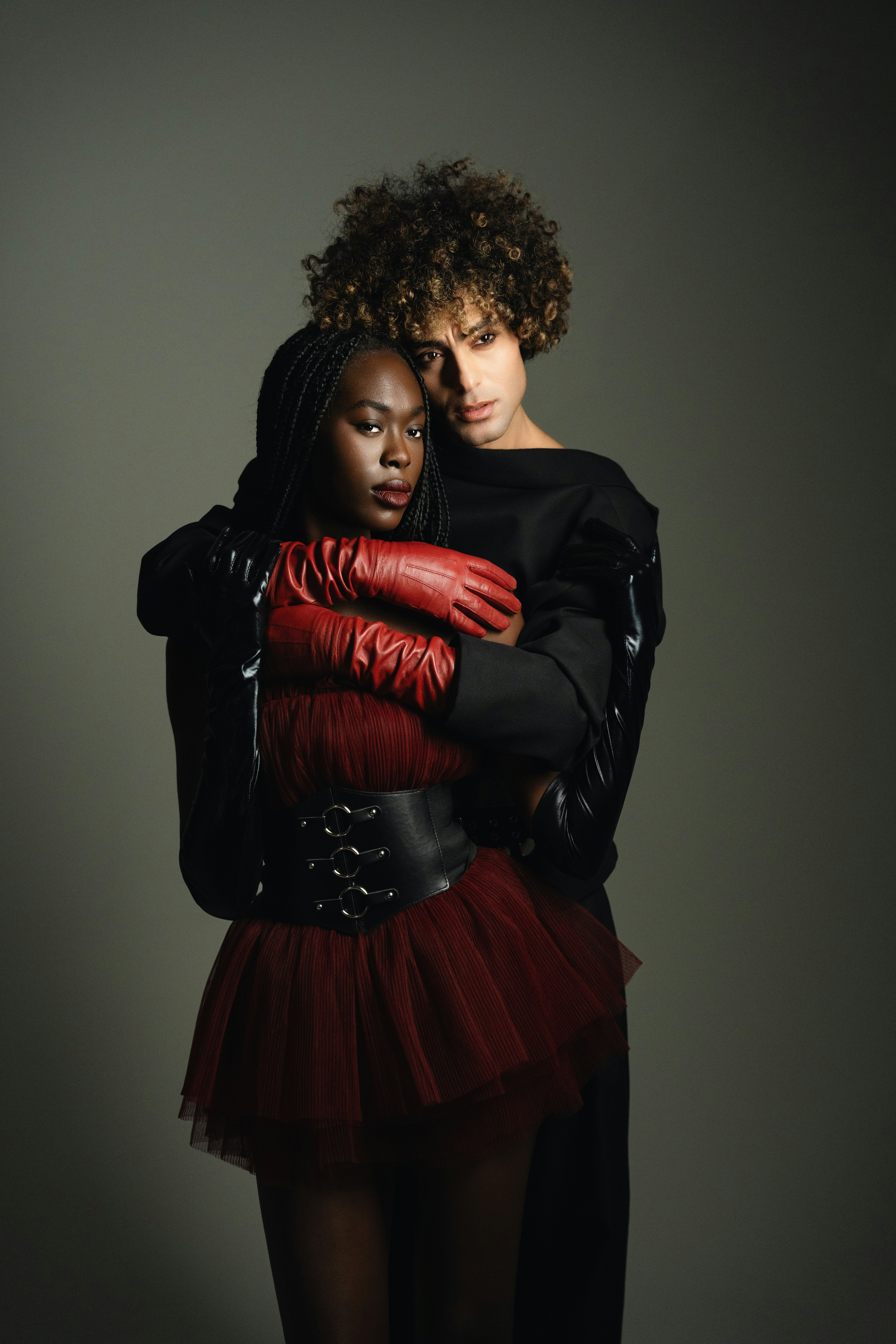 Two fashionable people embrace in a studio portrait. photo – Free ...