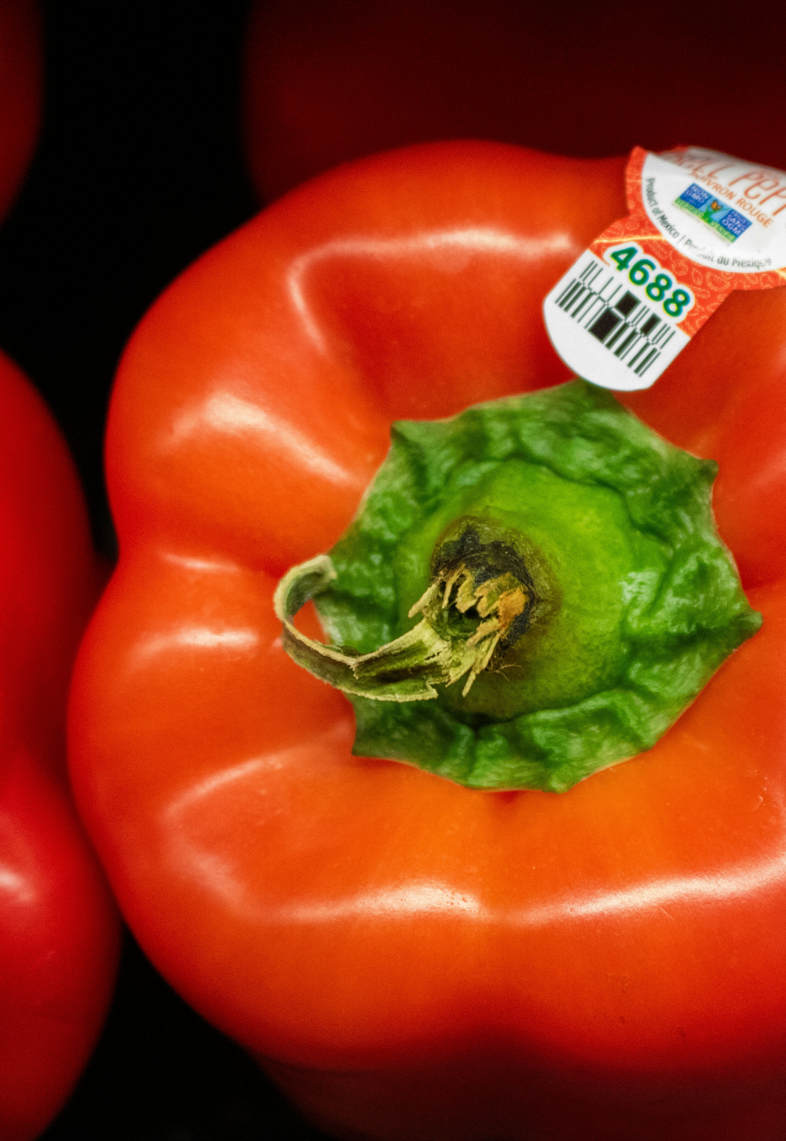 Scarlet Bell Pepper Close-Up: Textured Surface and Barcode Sticker