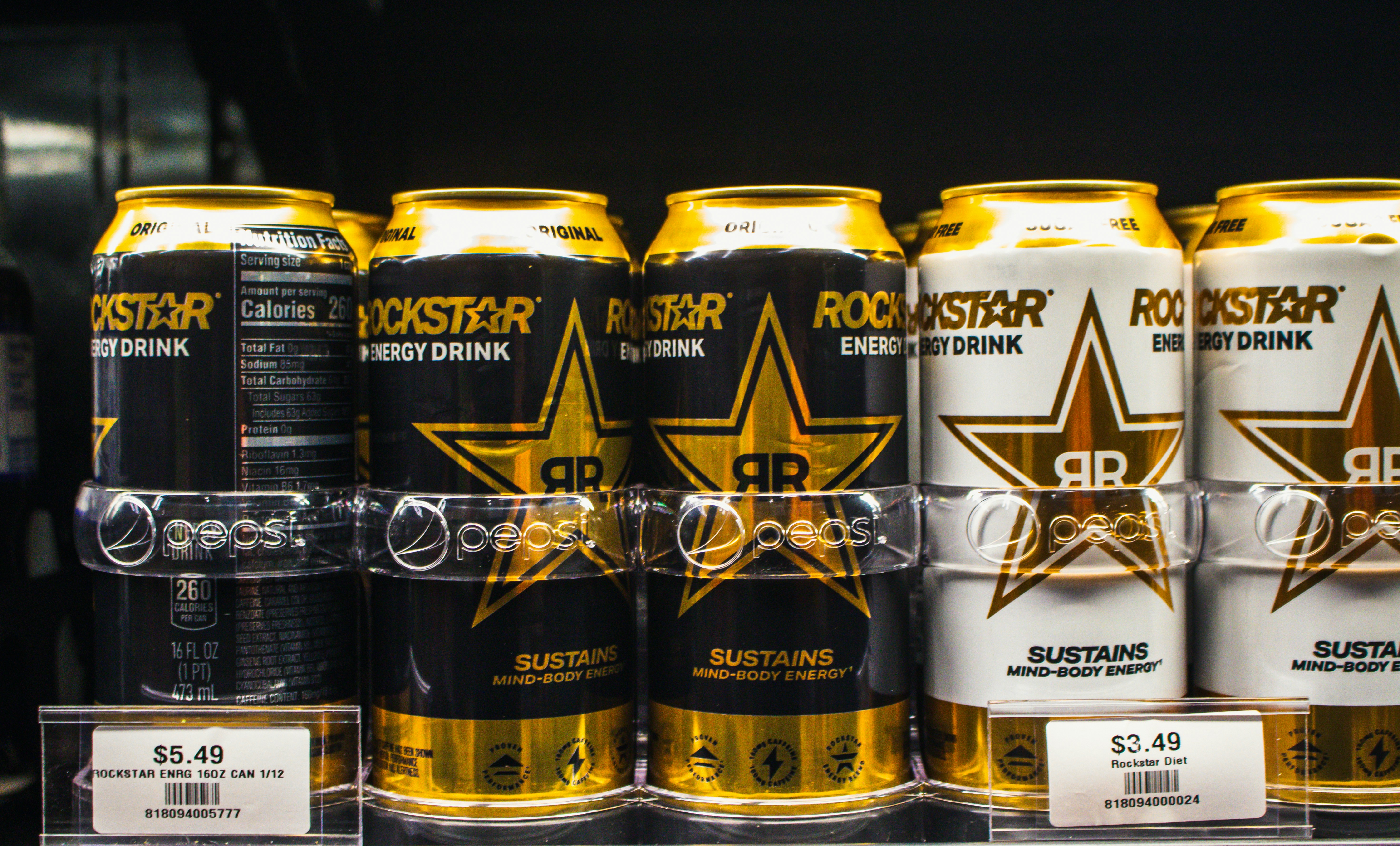 Rockstar energy drinks are displayed on a shelf. photo – Free ...