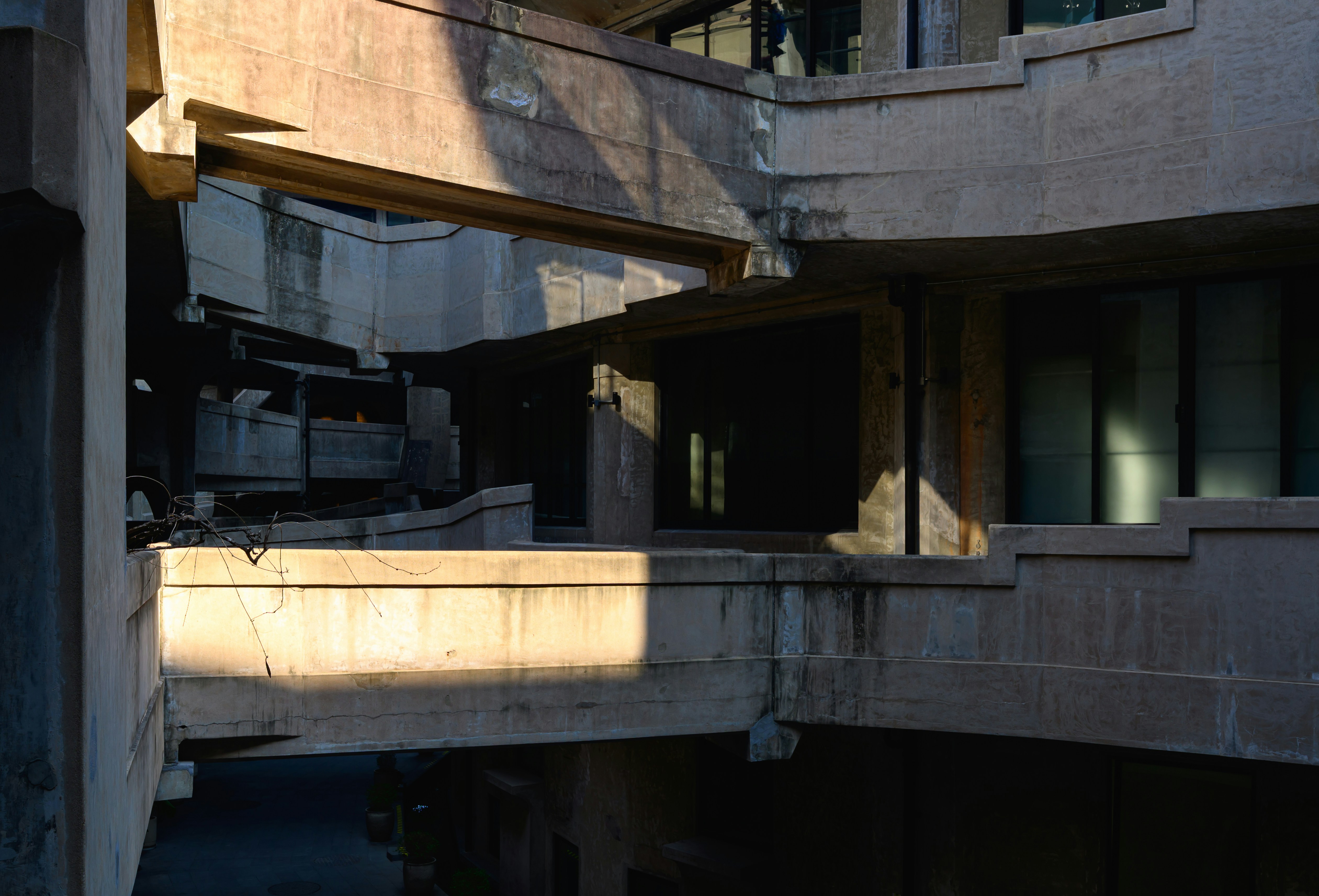 A concrete building's overhanging balconies. photo – Free Architecture ...