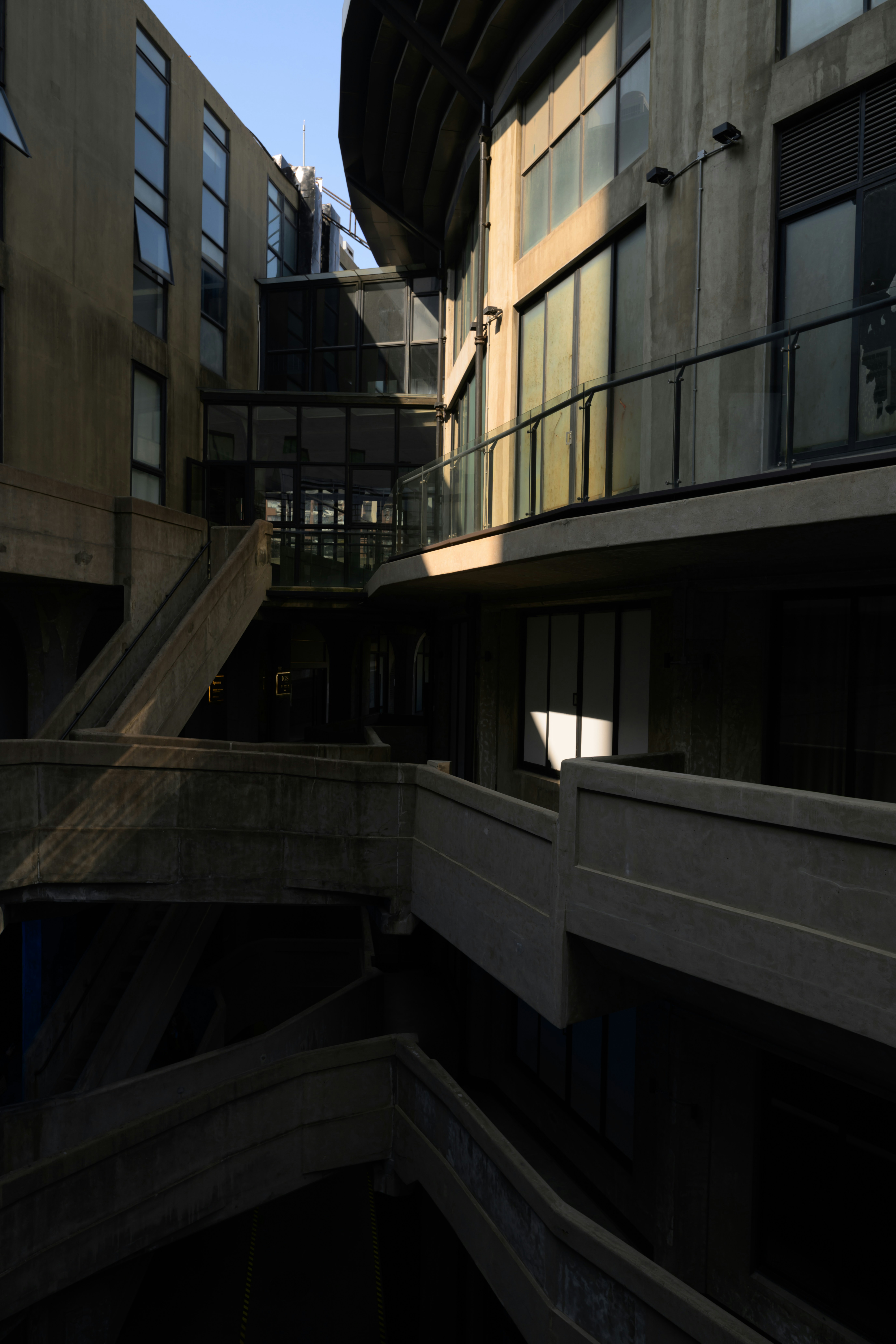 A concrete brutalist building with stairs and windows. photo – Free ...