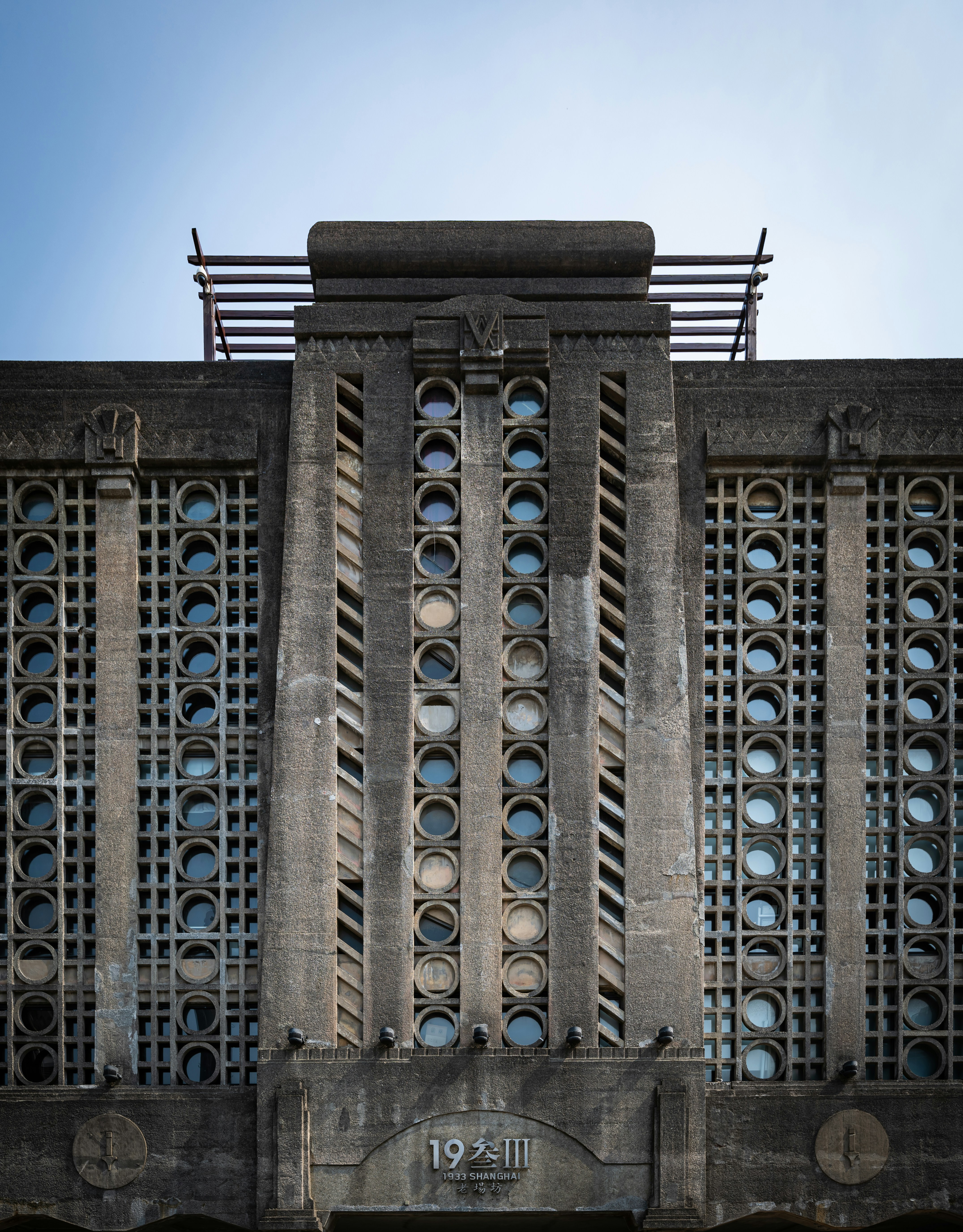 Art Deco Facade: Vertical Columns Framing a Central Gate