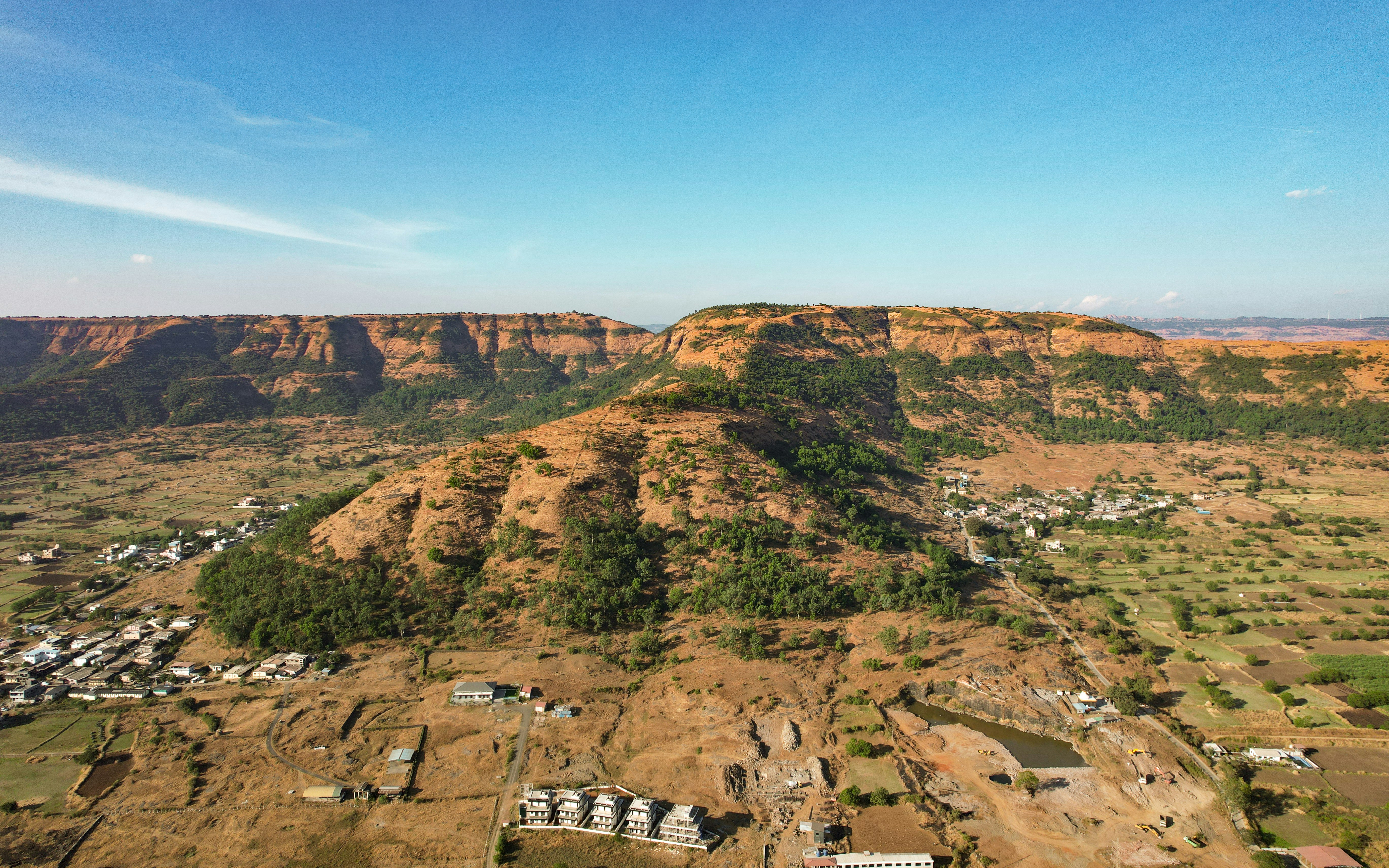 Desert mesas under a cobalt sky: a village carved into clay and stone