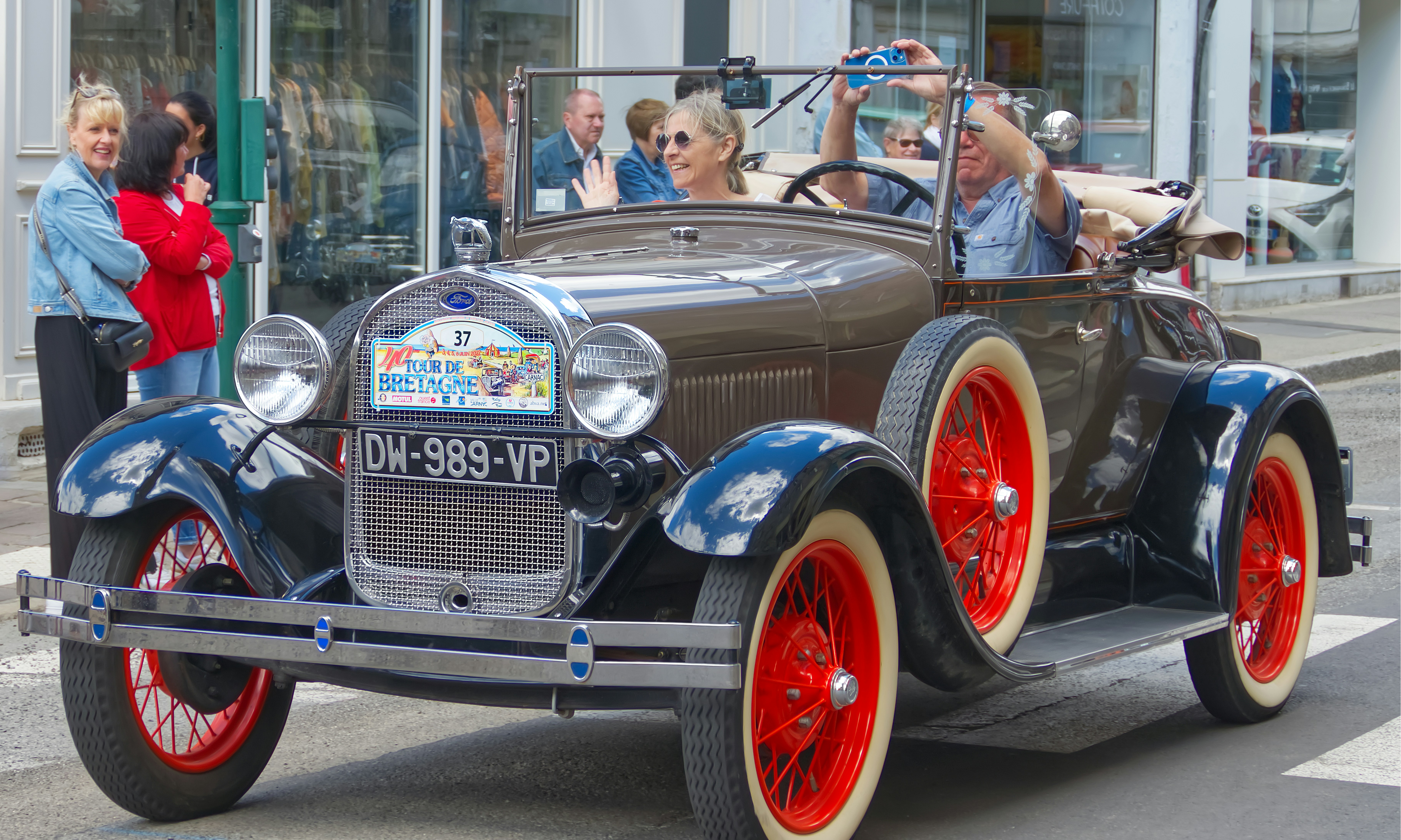 Crimson Wheels and Chrome: A 1920s Convertible Stands Out on a City Street