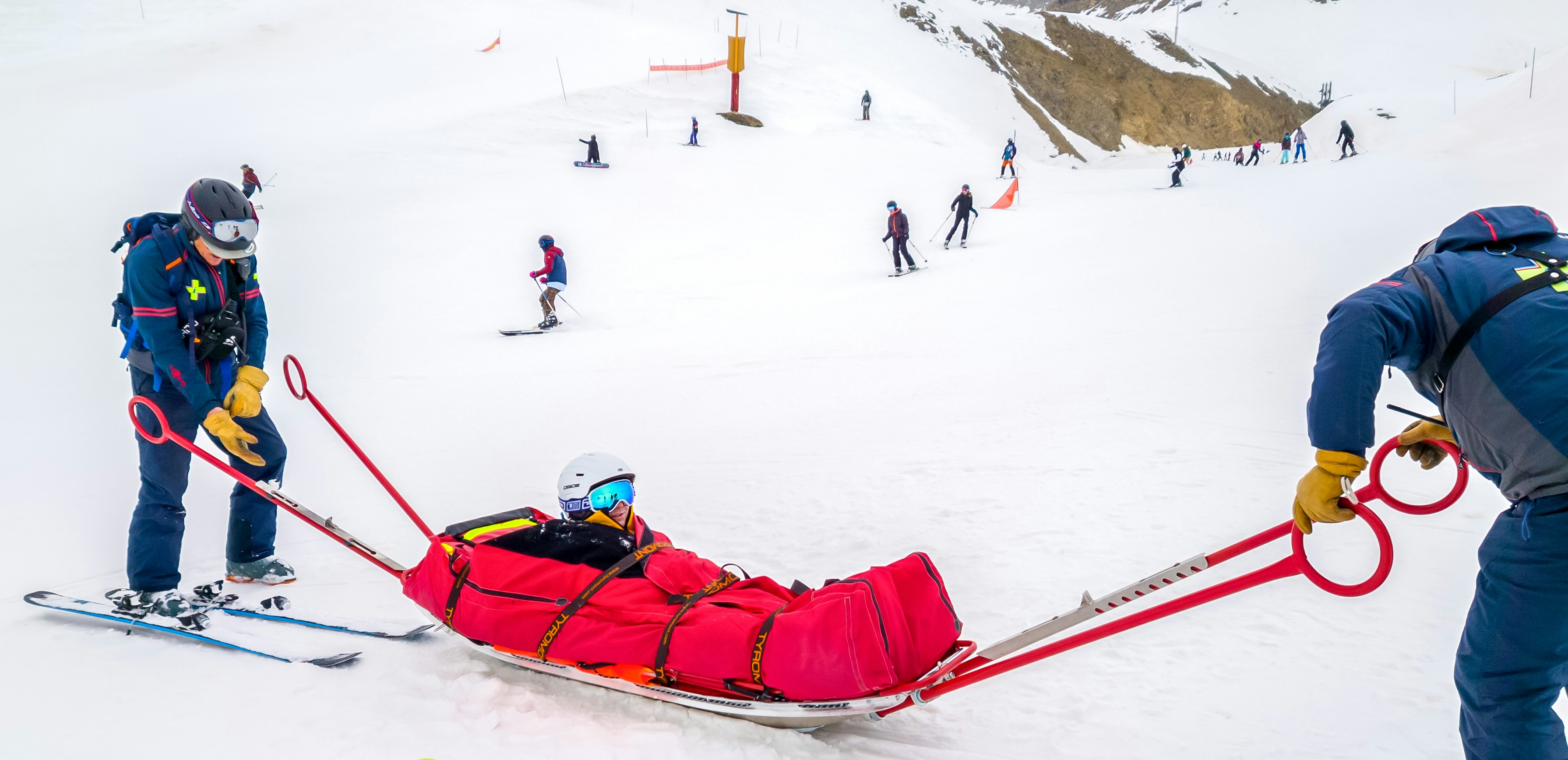 Ski patrol rescues an injured skier on a sled. photo – Free Winter ...