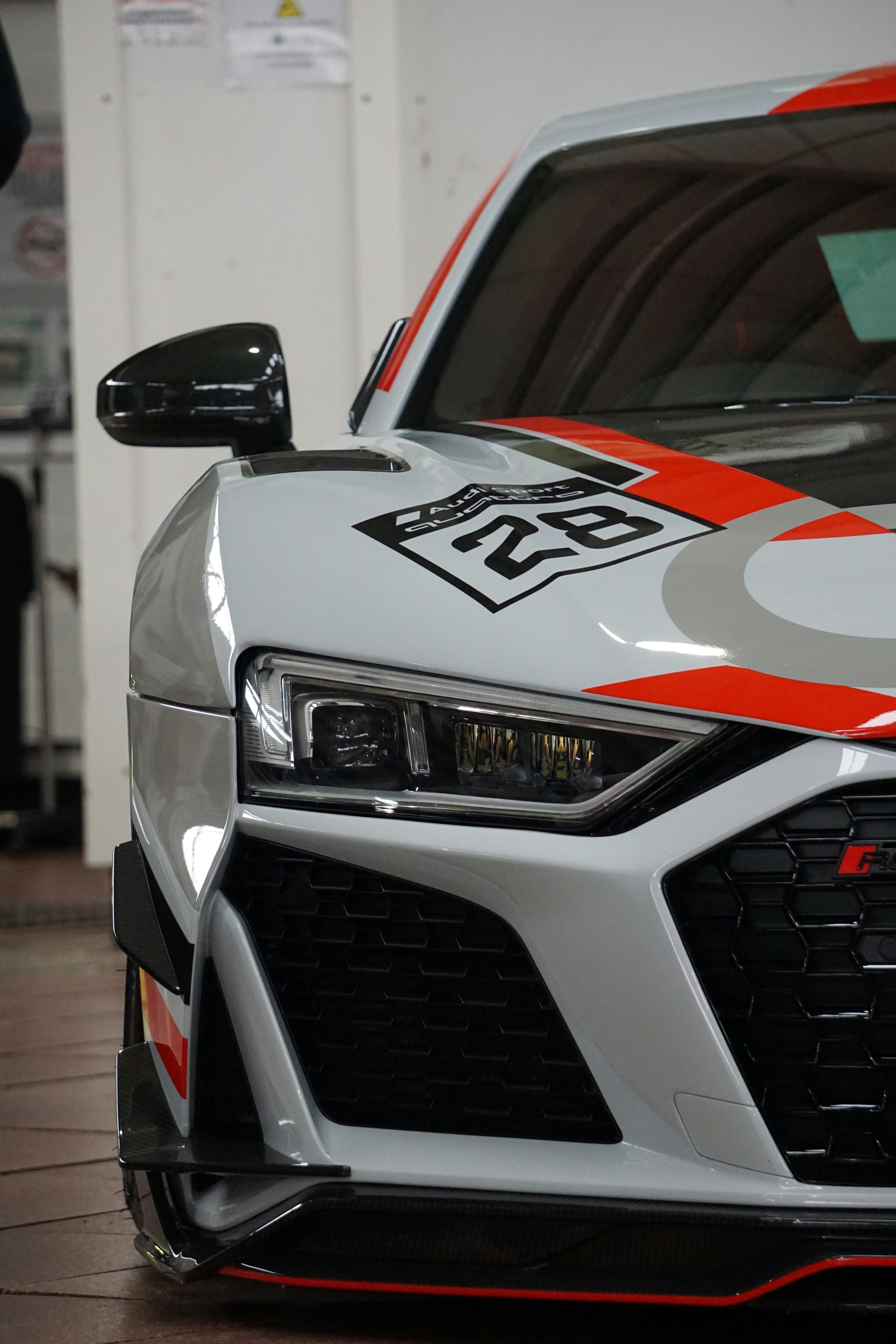 Close-up of a white audi r8 with racing stripes. photo – Free Car Image ...