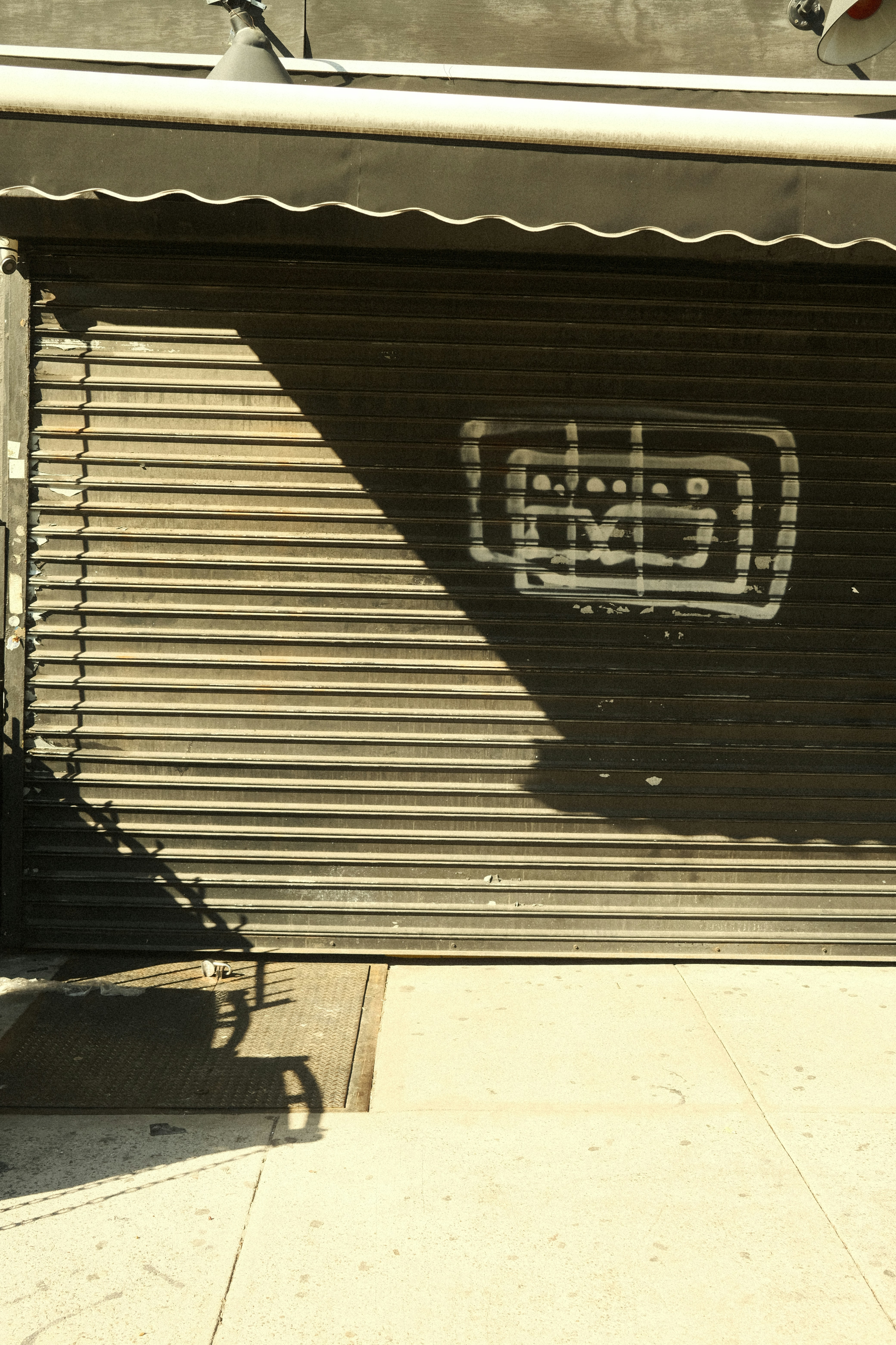 Closed store shutter with a strange marking. photo – Free City Image on ...