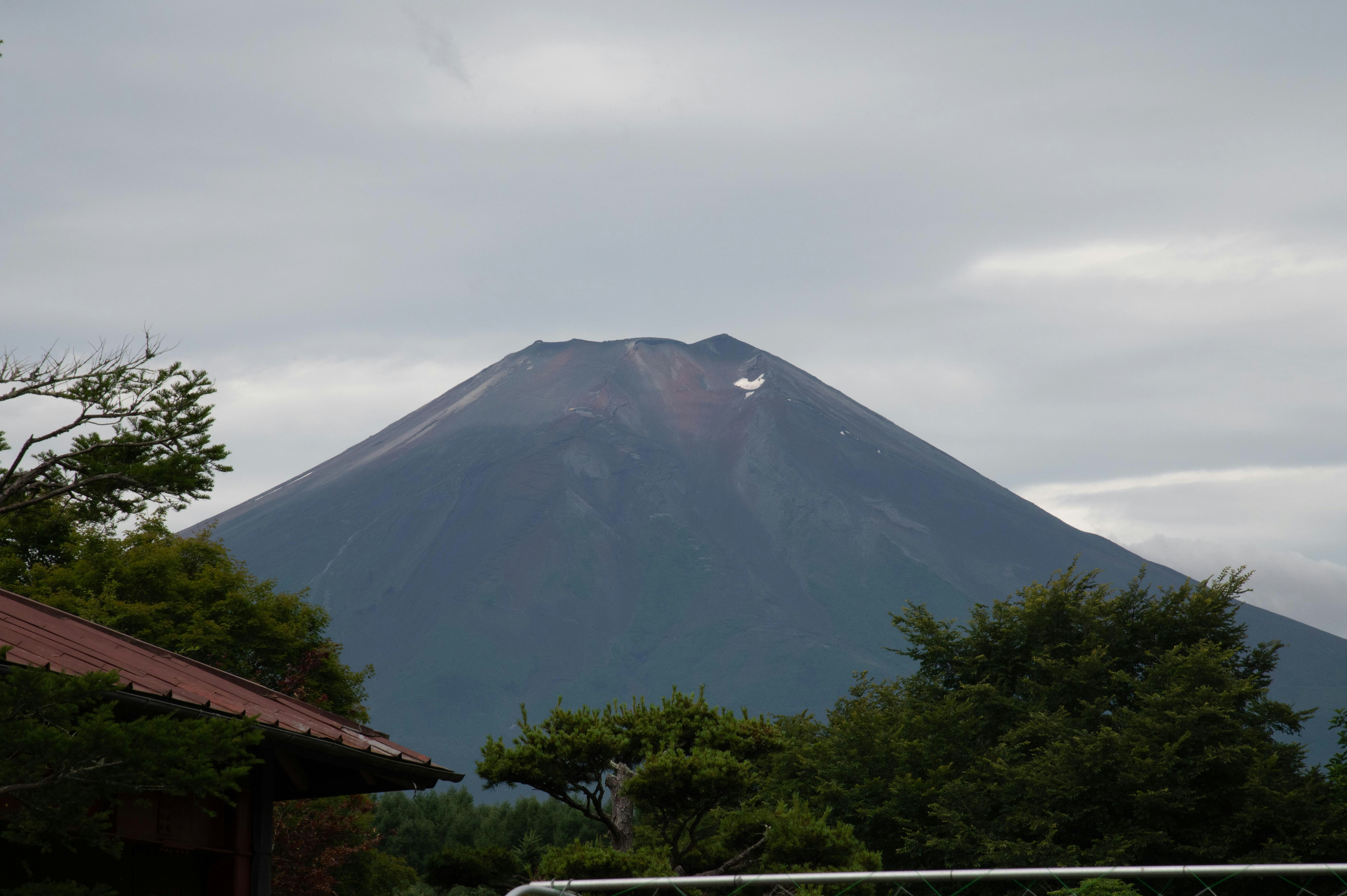 Veiled Summit: A Quiet Volcano Framed by Valley Greens