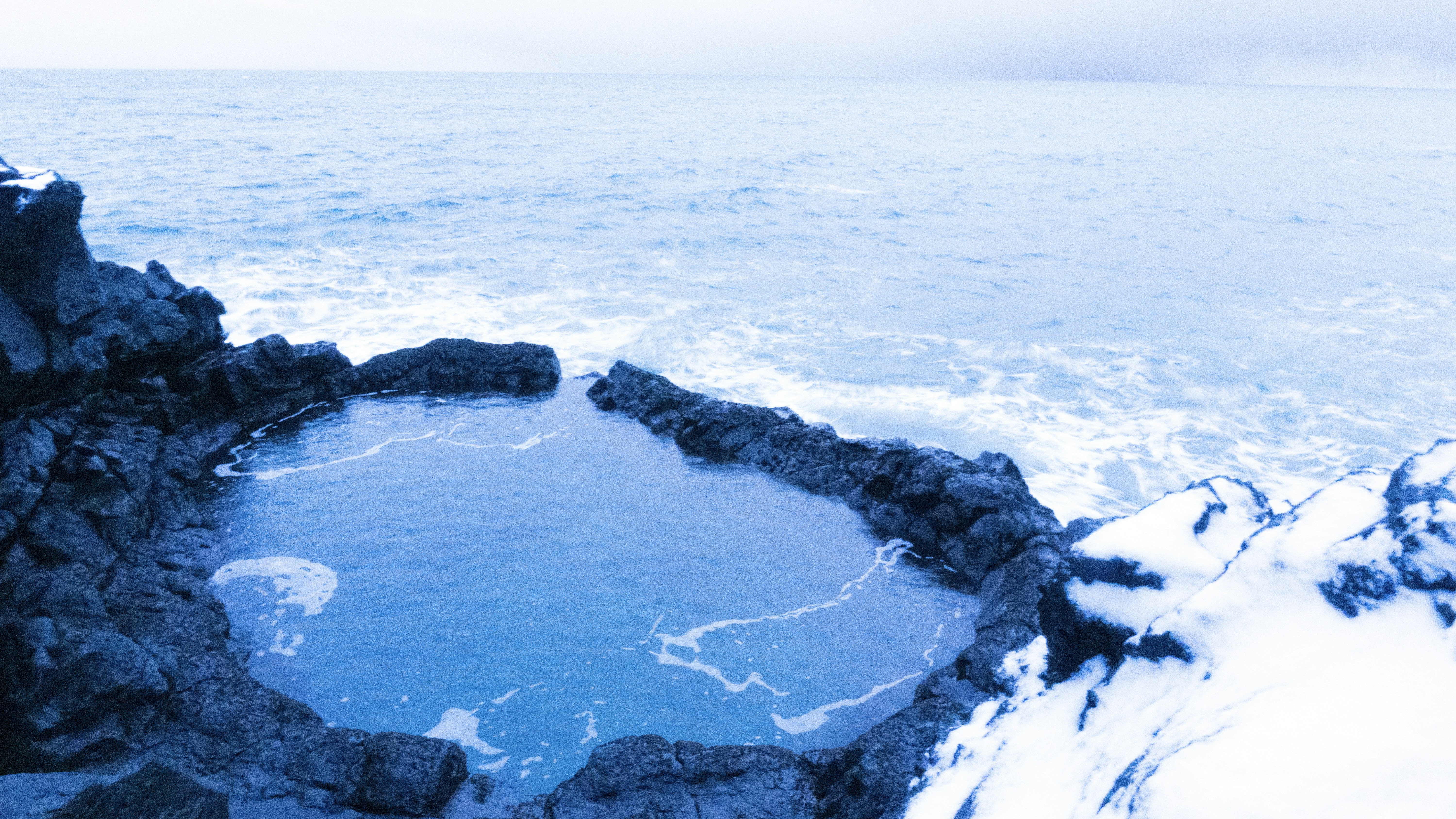 Winter's Edge: Where Rock Meets Sea