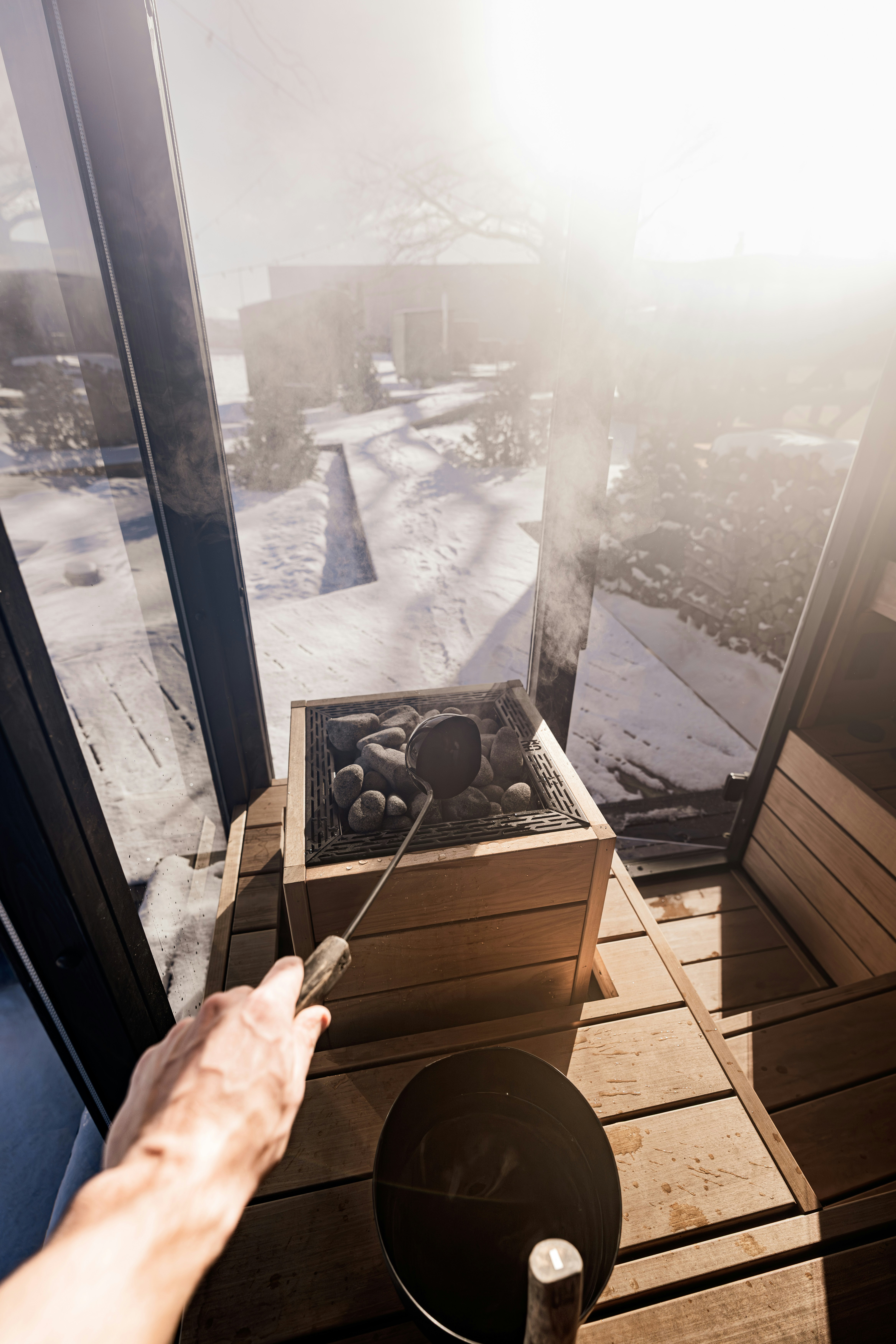 A person enjoys a sauna with an outdoor view. photo – Free Sauna Image ...
