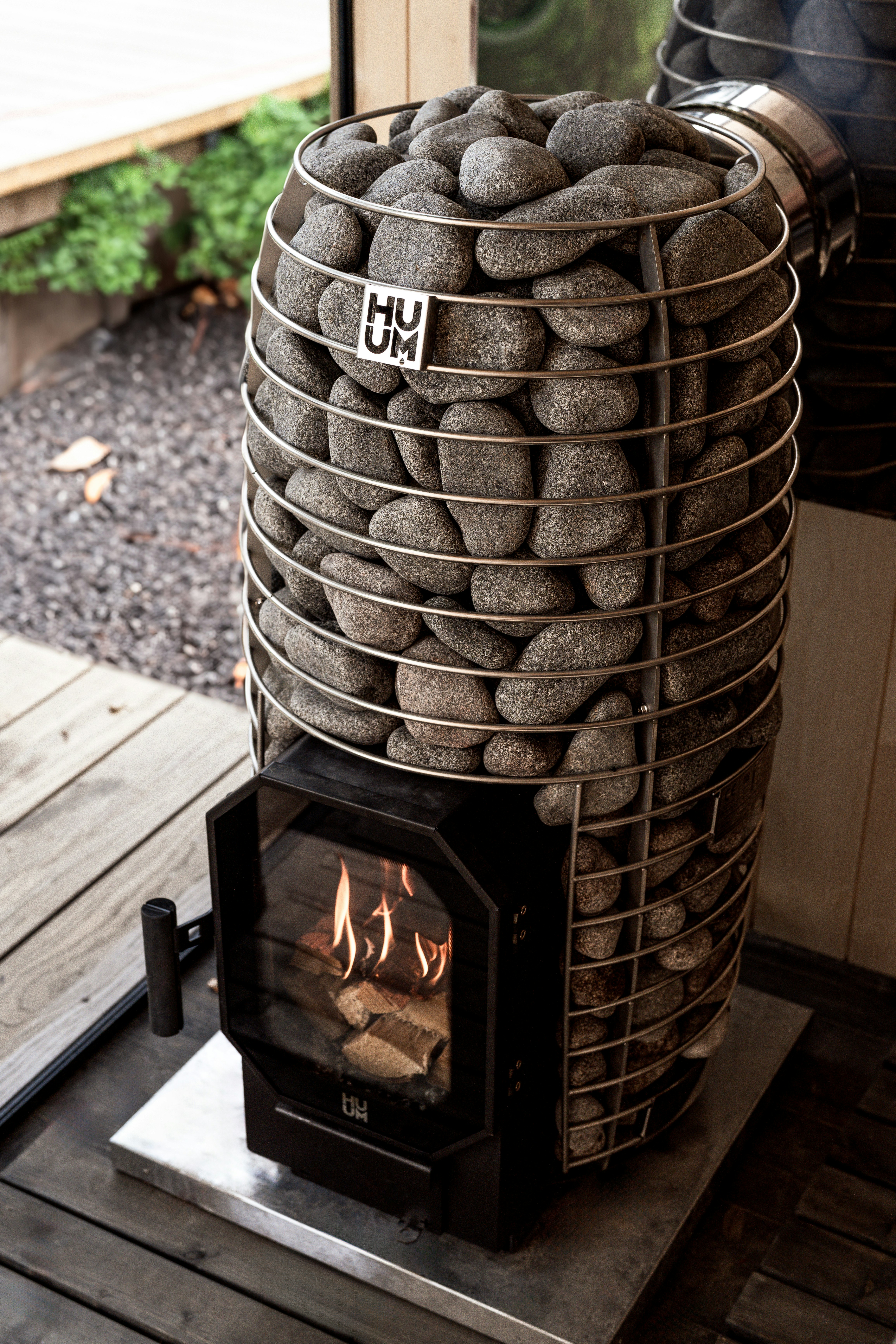 A sauna stove with heated rocks is visible. photo – Free Fireplace ...