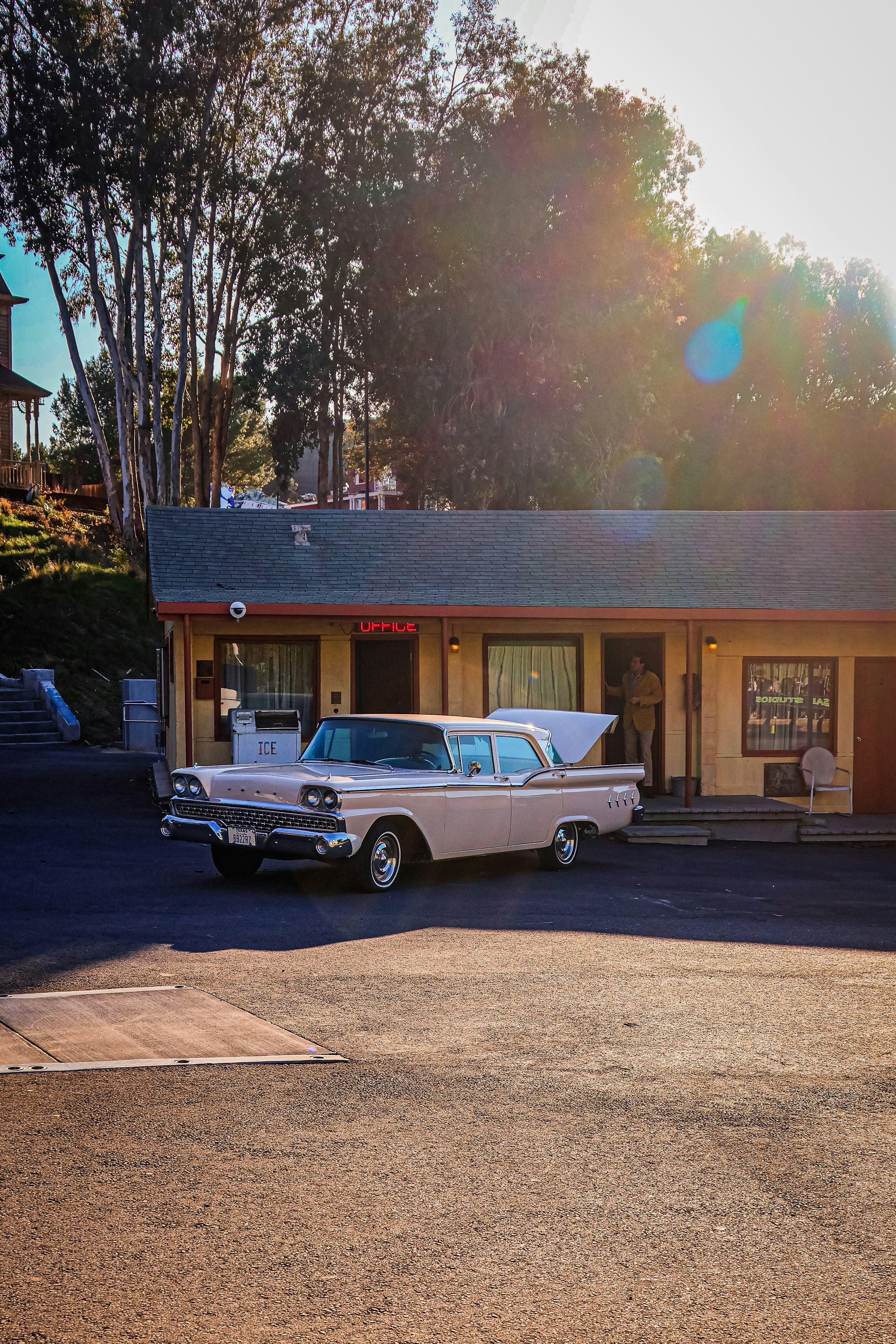 Movie set for movie Psycho | Vintage car parked outside a motel.