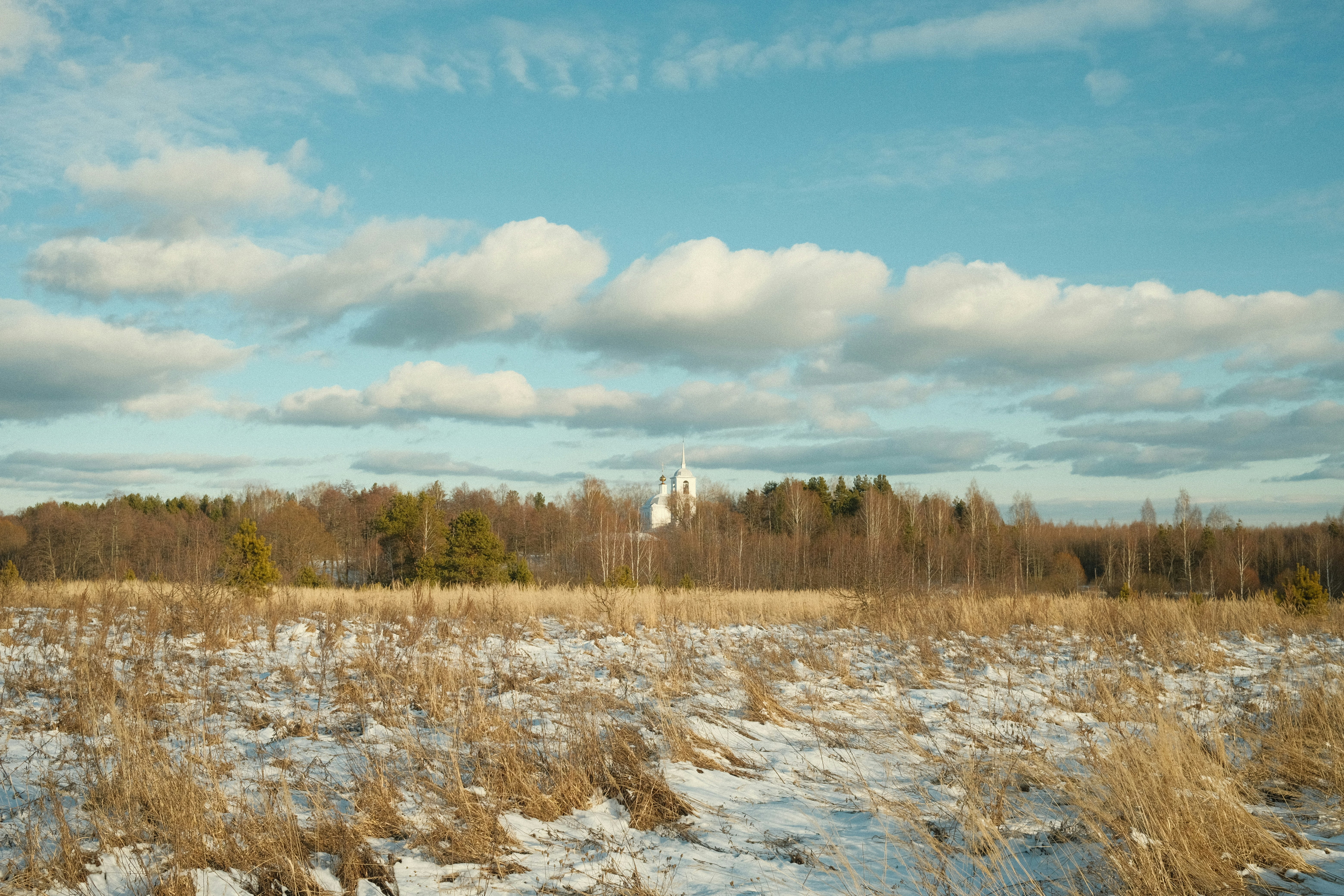 Whispers of Winter: A Distant Chapel View