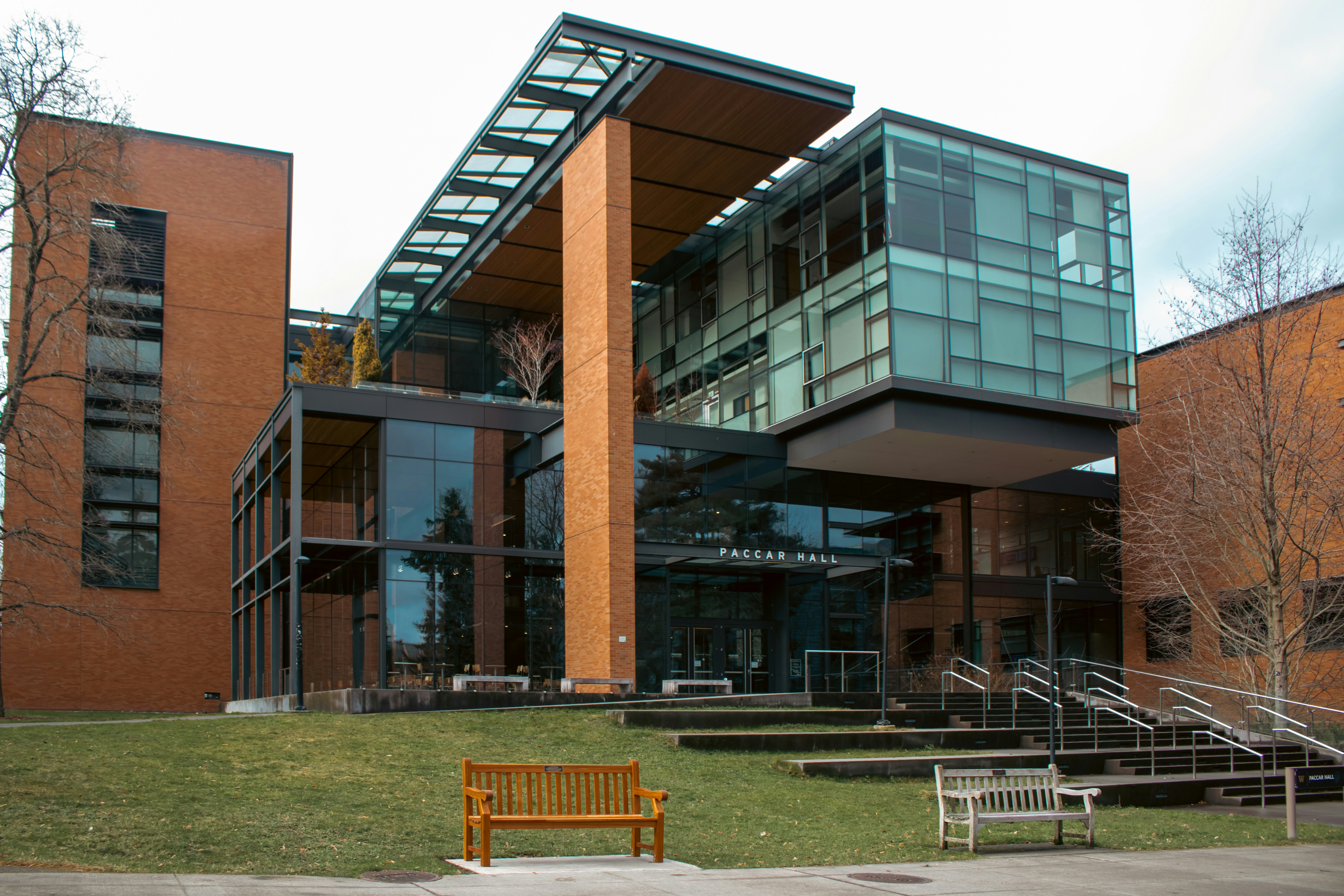 PACCAR Hall, home to the Foster School of Business at the University of Washington. Completed in 2010, this modern building was designed by LMN Architects to foster collaboration. It features a daylit atrium, transparent surfaces, and a popular two-story café. The building, funded by private donations including a significant gift from the Piggott family, incorporates sustainable features earning LEED Gold certification. It includes classrooms, breakout rooms, an auditorium, and a terrace, serving as a hub for business education.