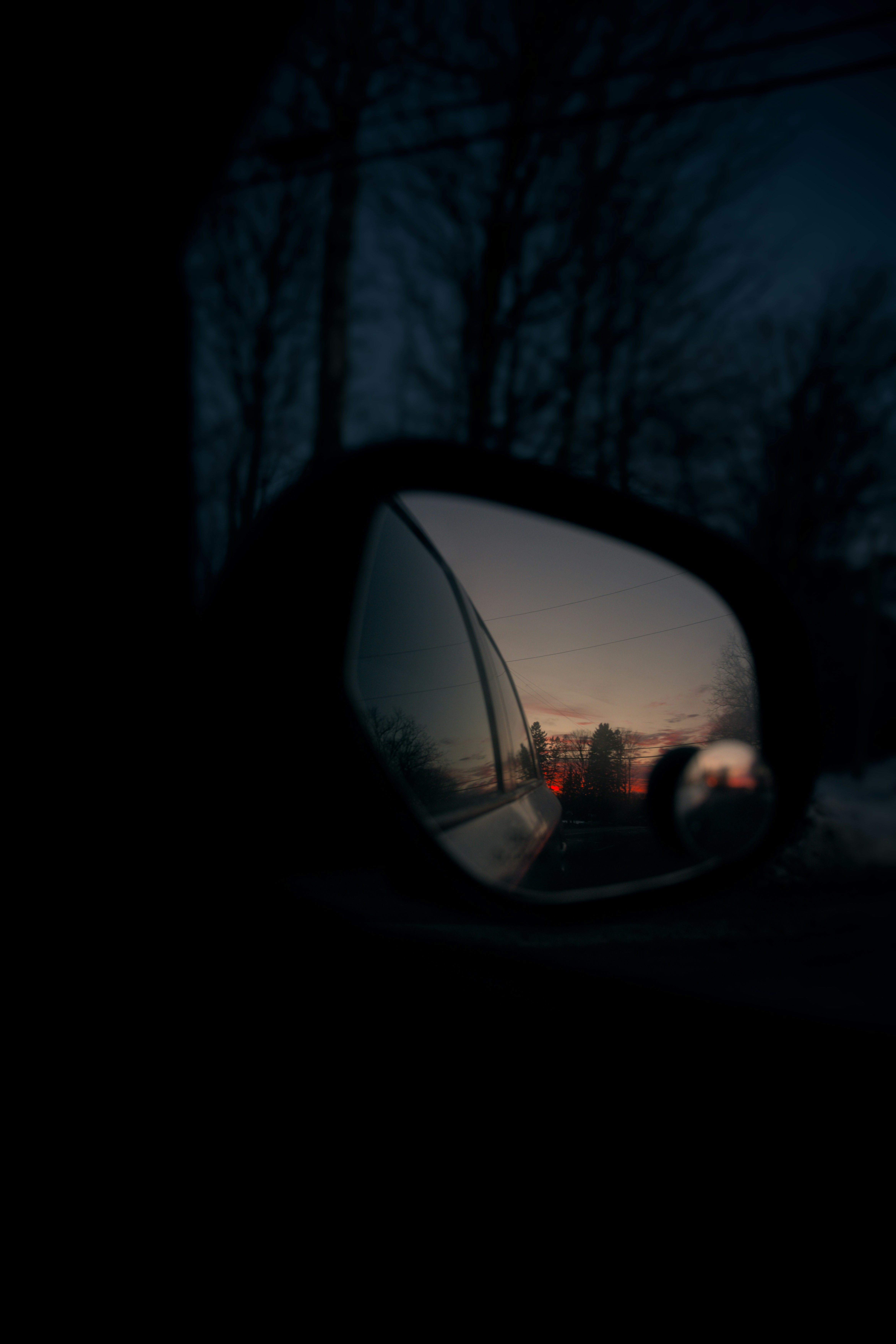 Sunrise in the reflection of a rear veiw mirrorDaniel Gomez