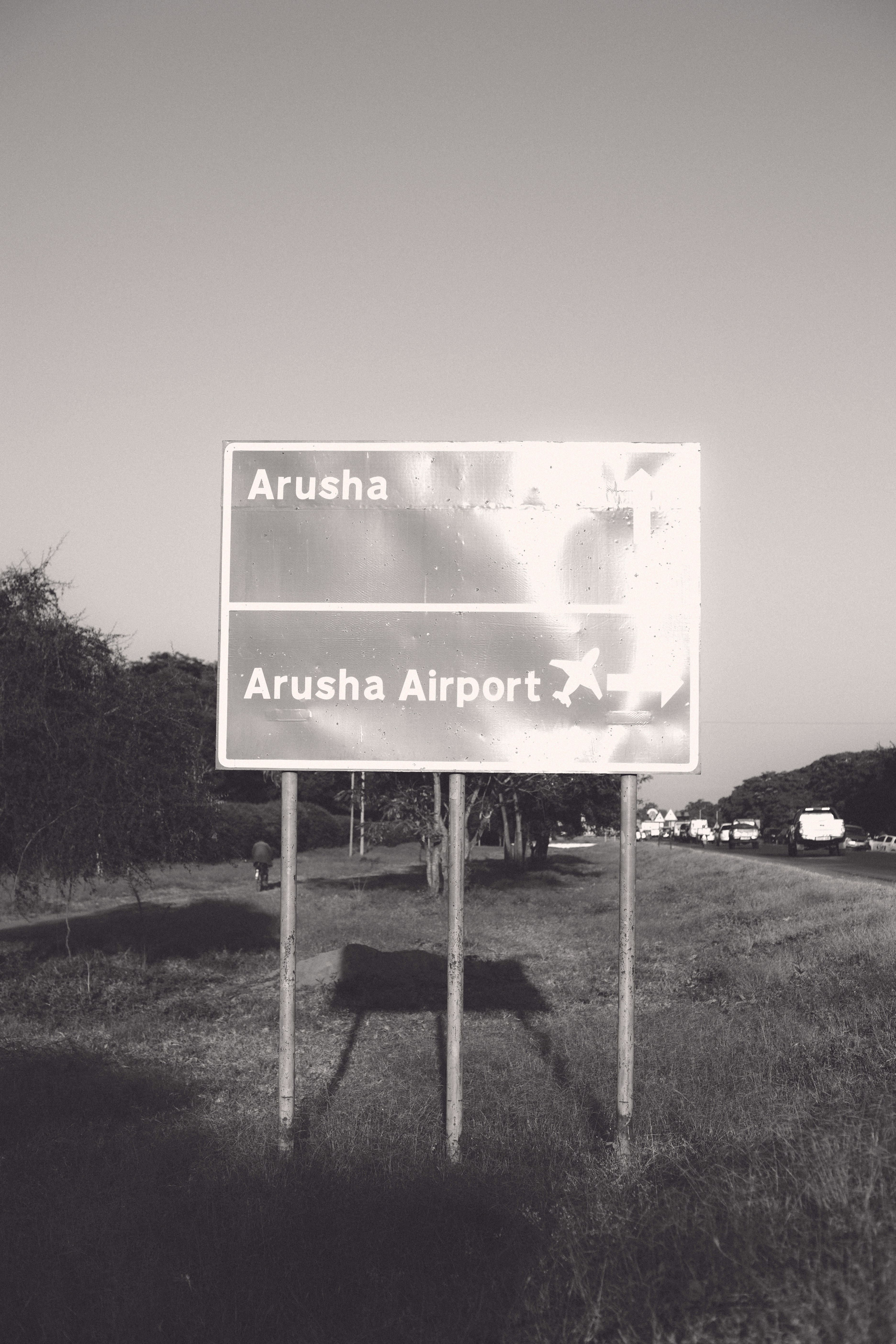 Sign points towards arusha and its airport. photo – Free Car Image on ...