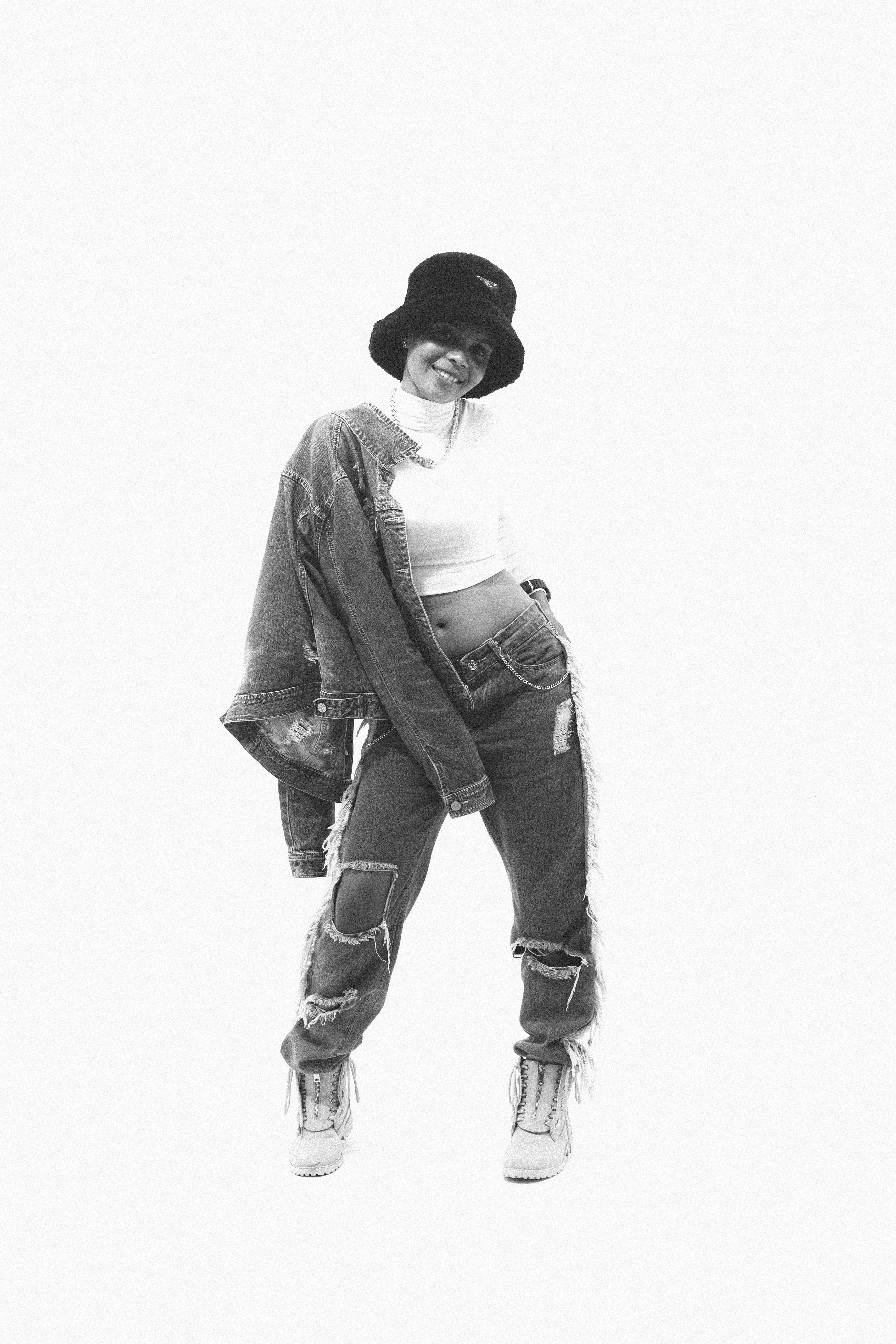 Woman in denim jacket and bucket hat poses. photo – Free Portrait Image ...