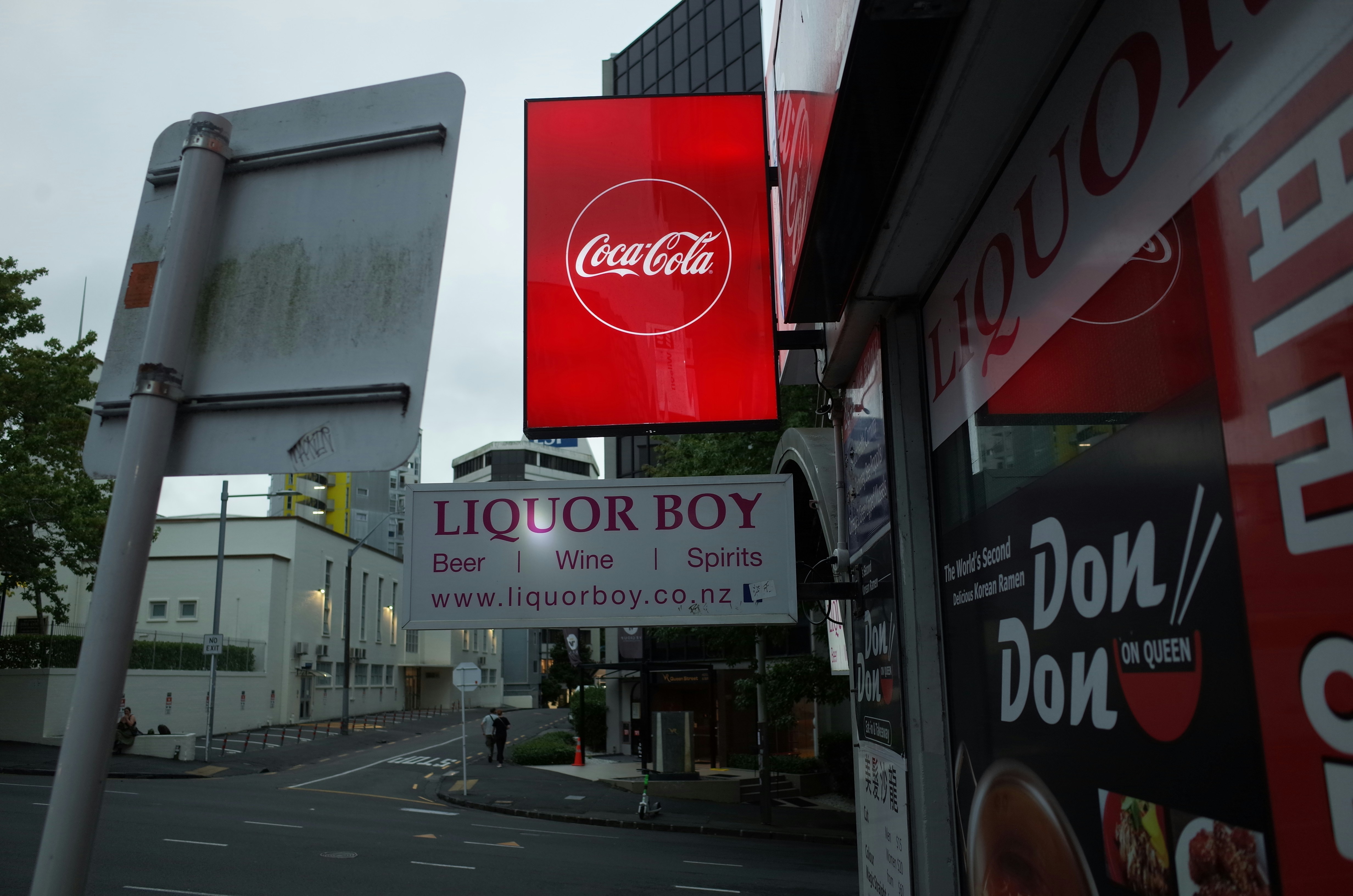 A coca-cola sign above a liquor store. photo – Free Building Image on ...