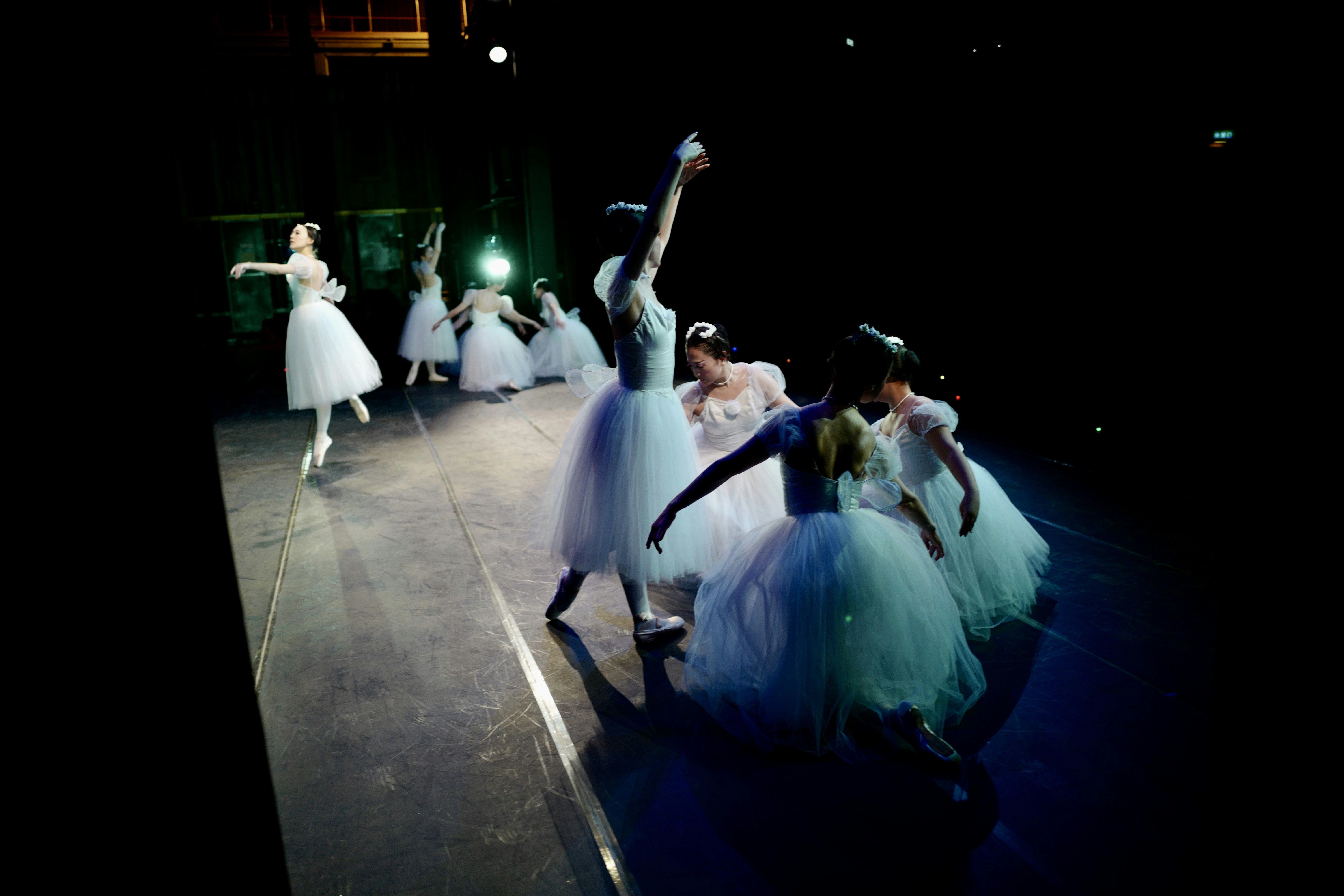 Ballet dancers perform gracefully on a brightly lit stage. photo – Free ...