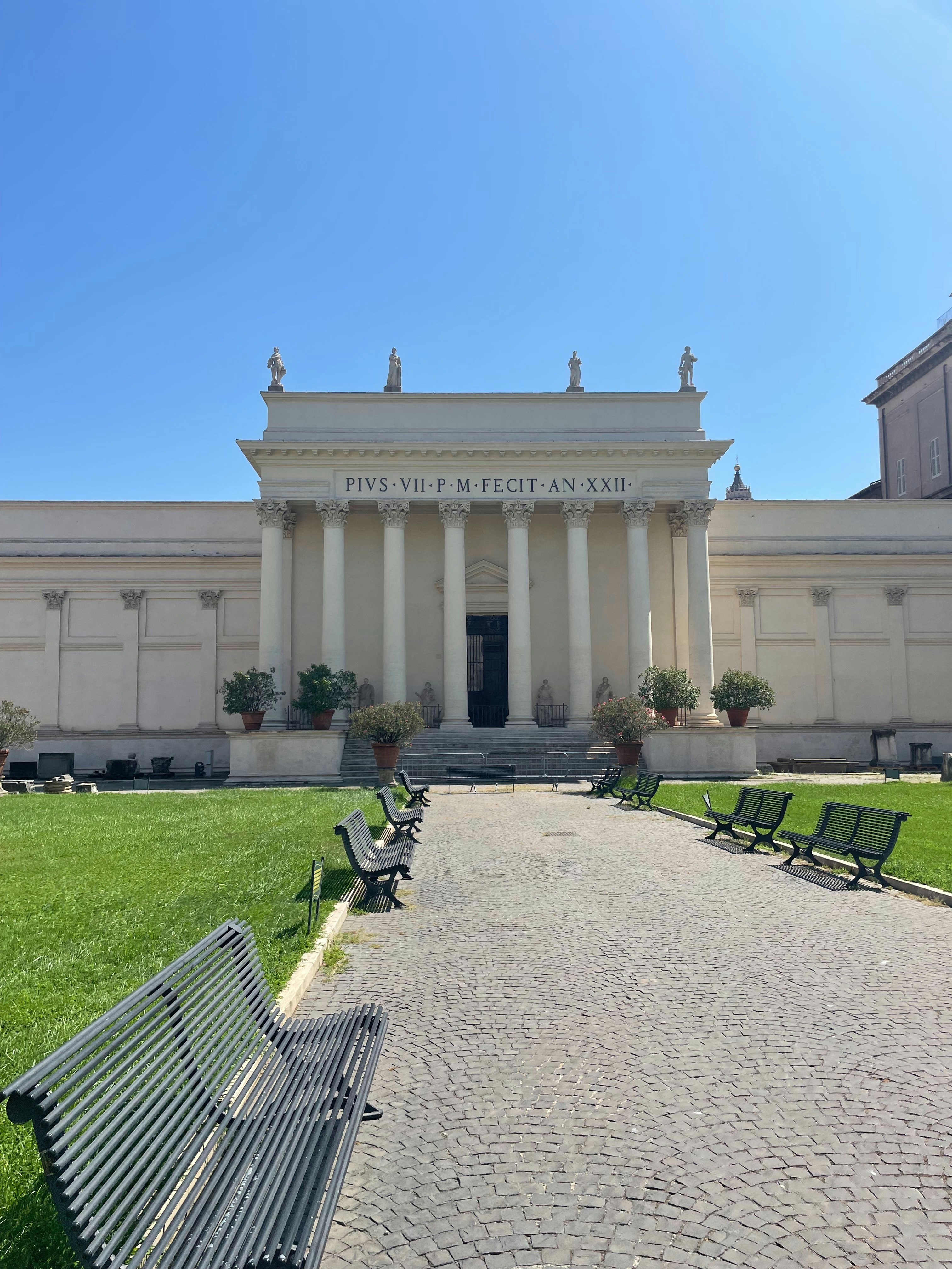 Neoclassical Facade Gate: A Quiet Walk Toward the Pillared Entrance