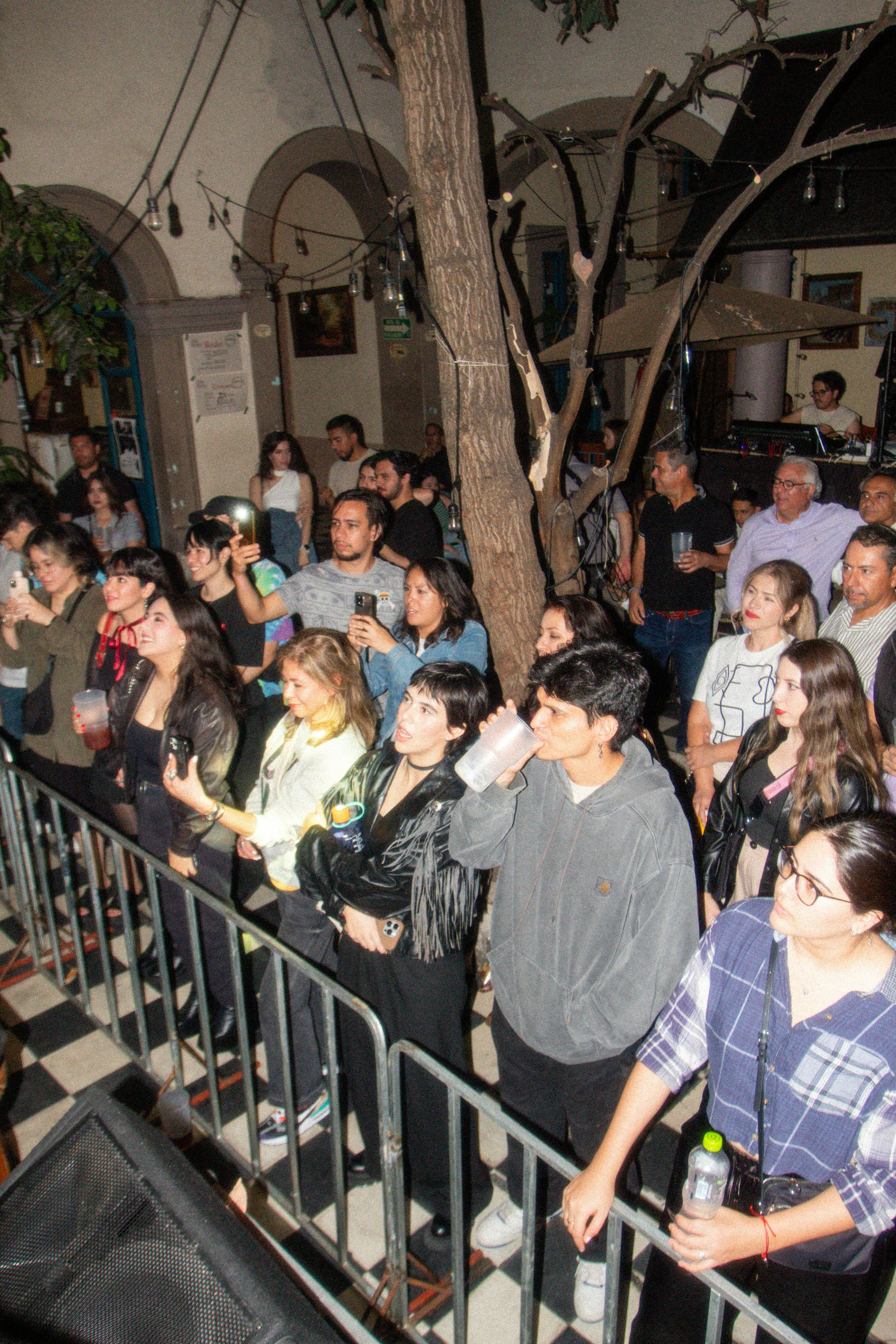 A crowd watches a performance outdoors. photo – Free Woman Image on ...