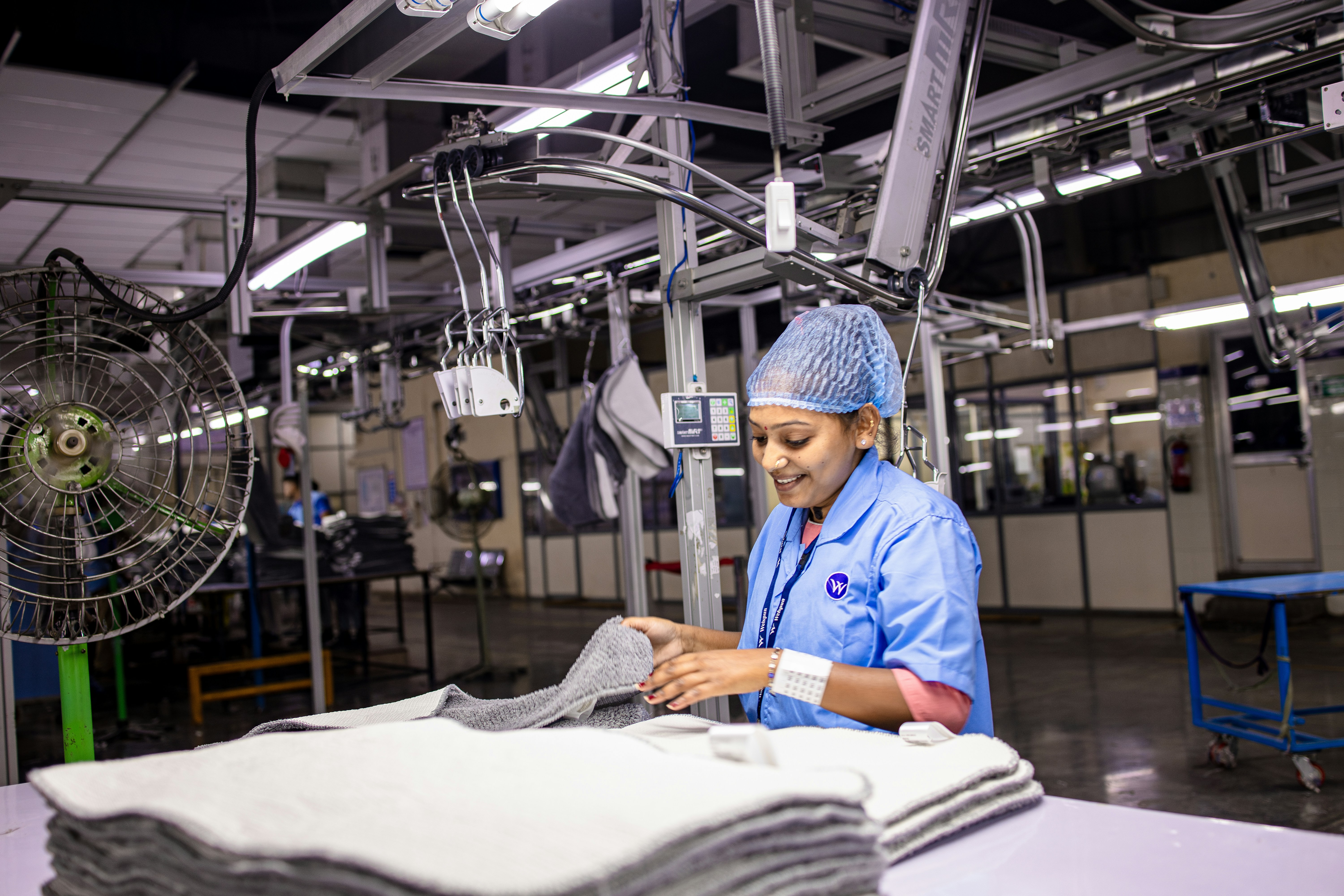 Woman working at a textile factory in a factory. photo – Free Worker ...