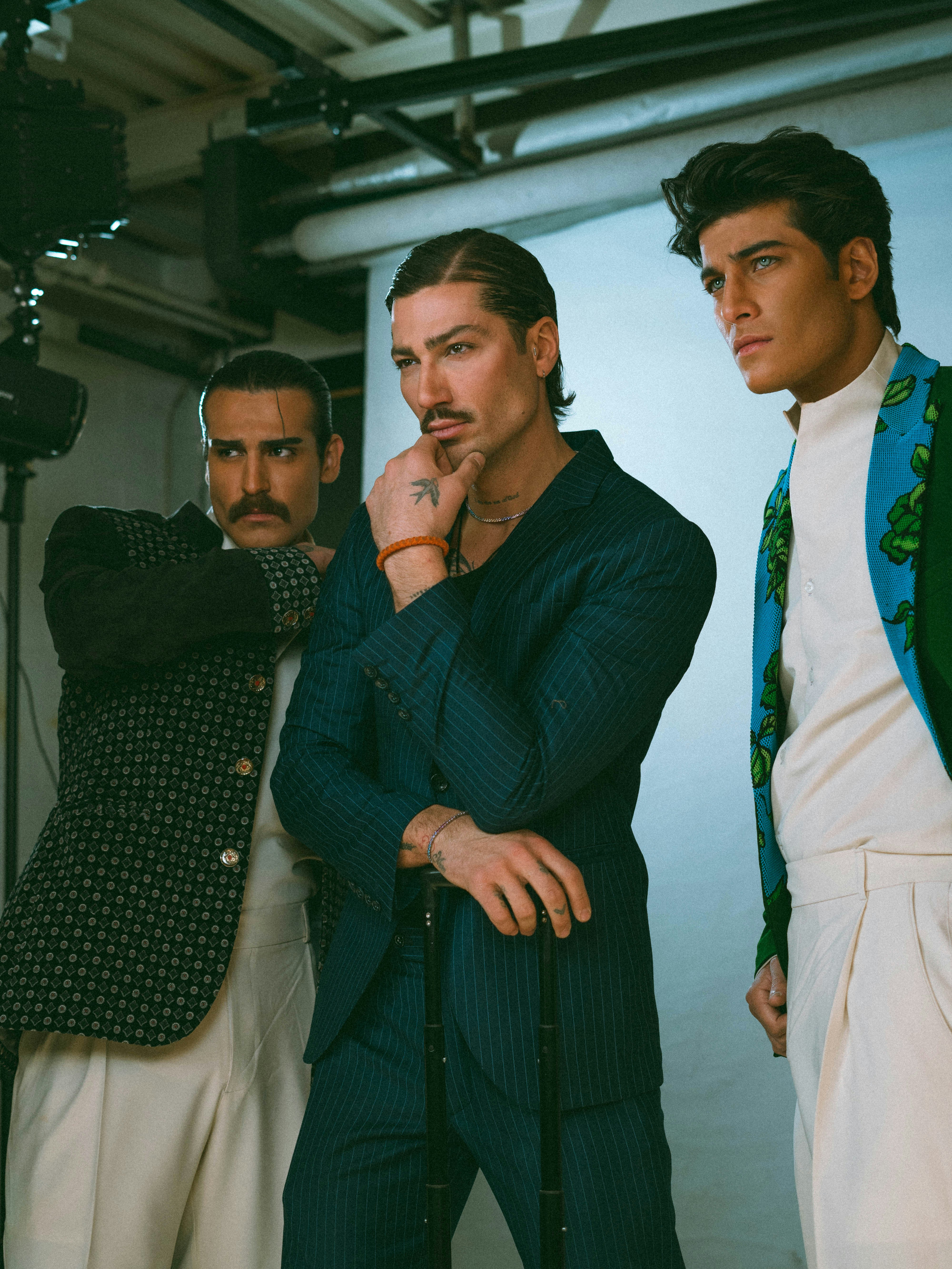 Three models pose for a photoshoot in a studio. photo – Free Man Image ...