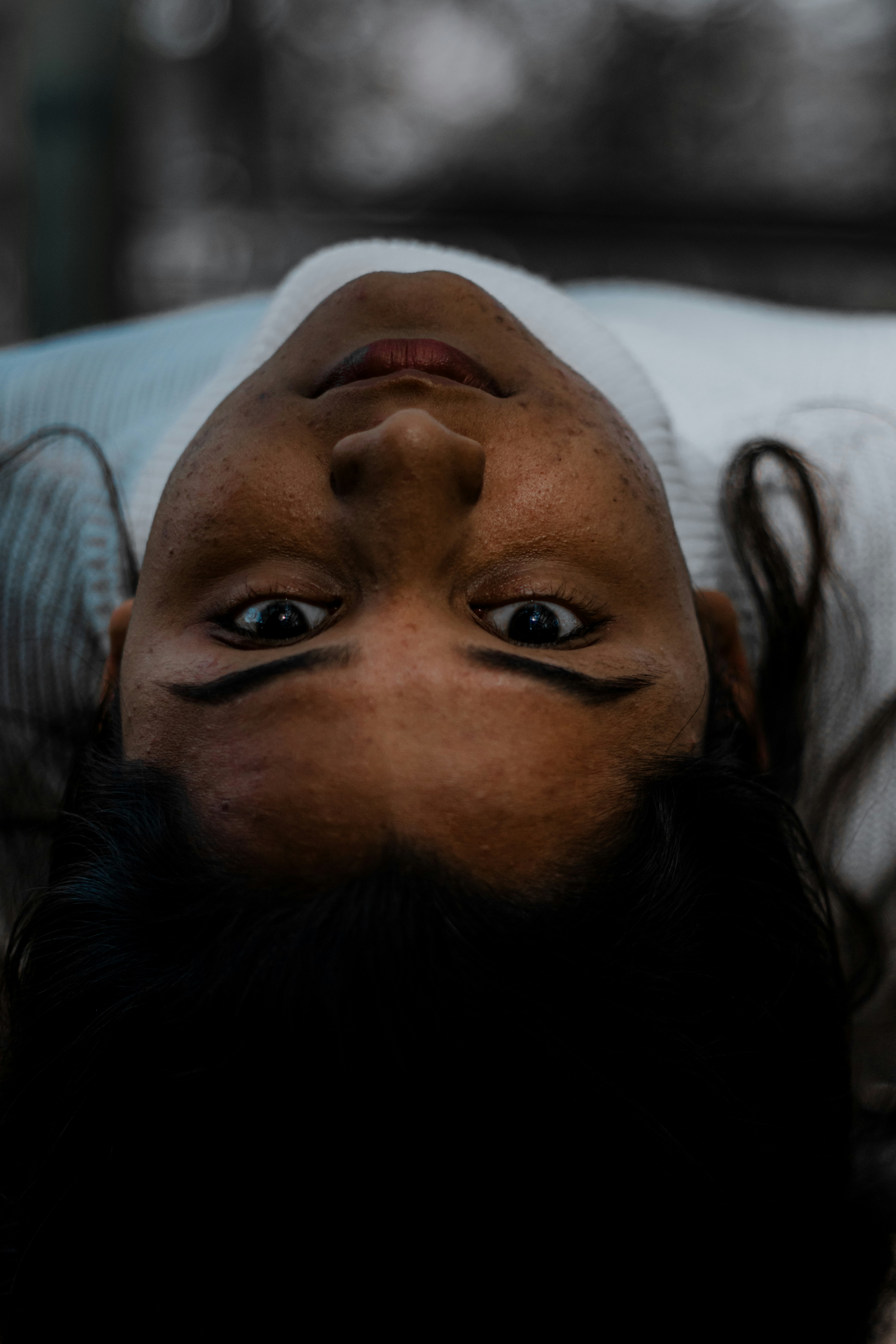 A woman looks intensely upward at the viewer. photo – Free Portrait ...