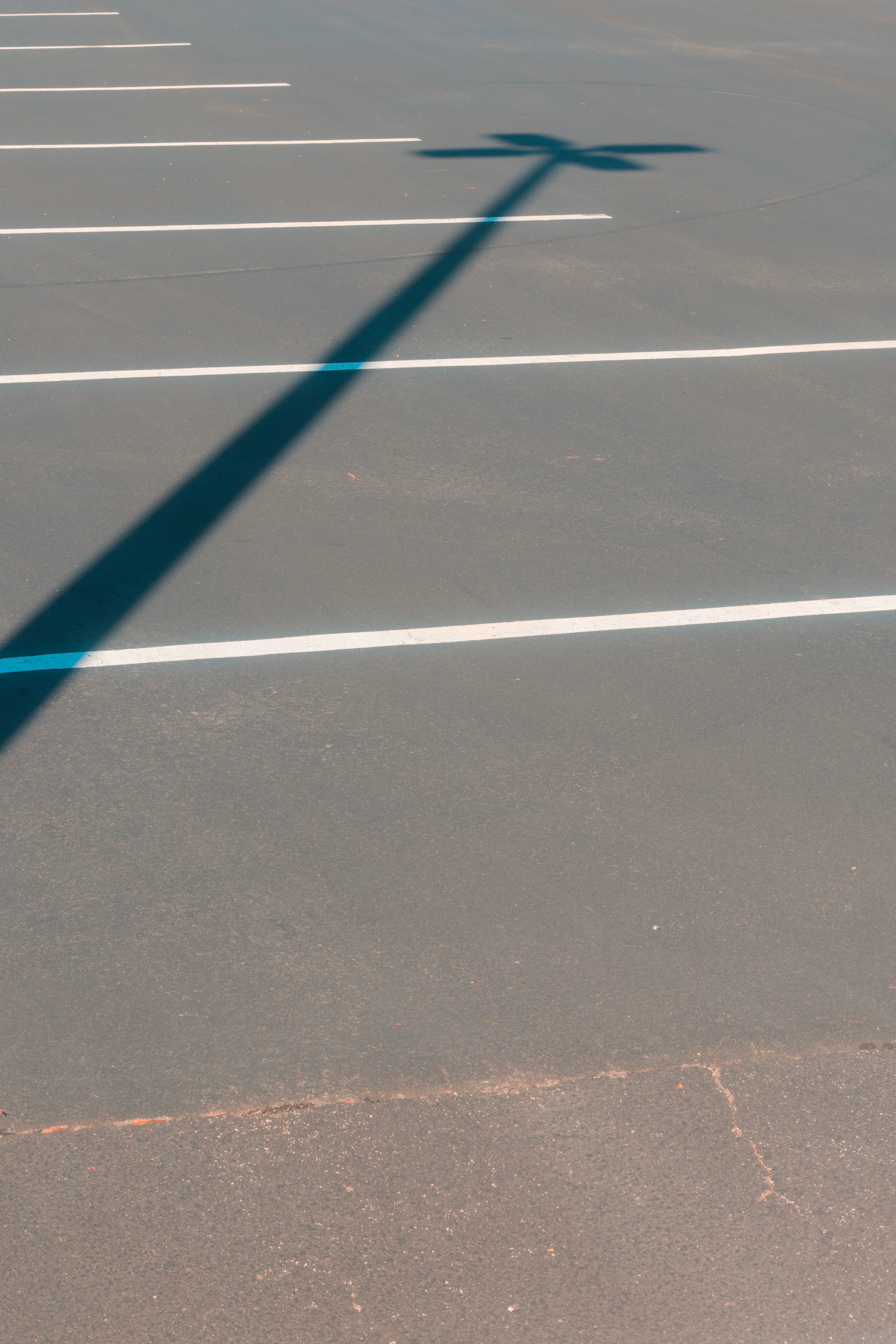 Diagonal Shadow over an Empty Lot: The Quiet Geometry of a Streetlight