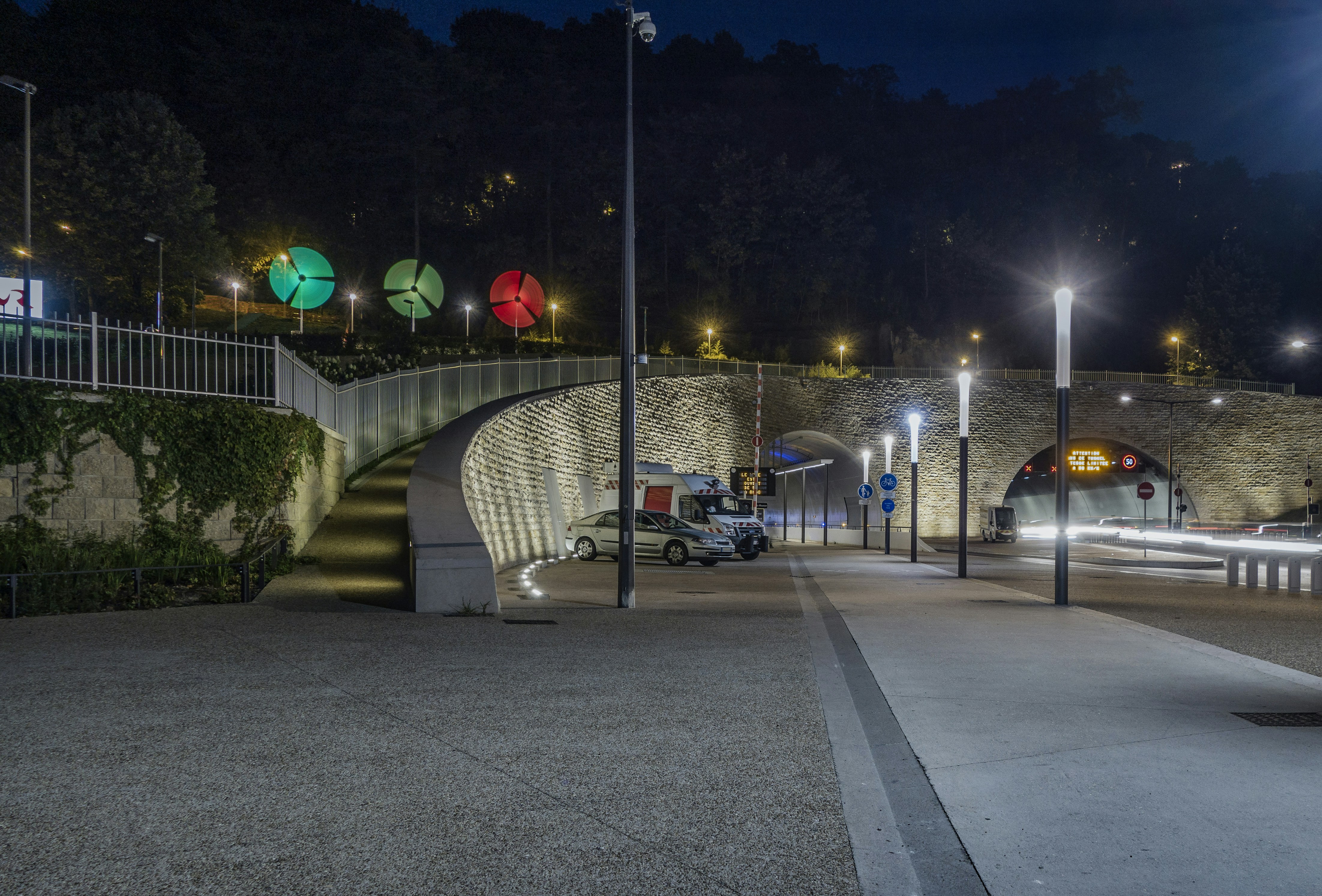 Neon Orbs and the Night Arches: A Walk Toward the Lighted Tunnel
